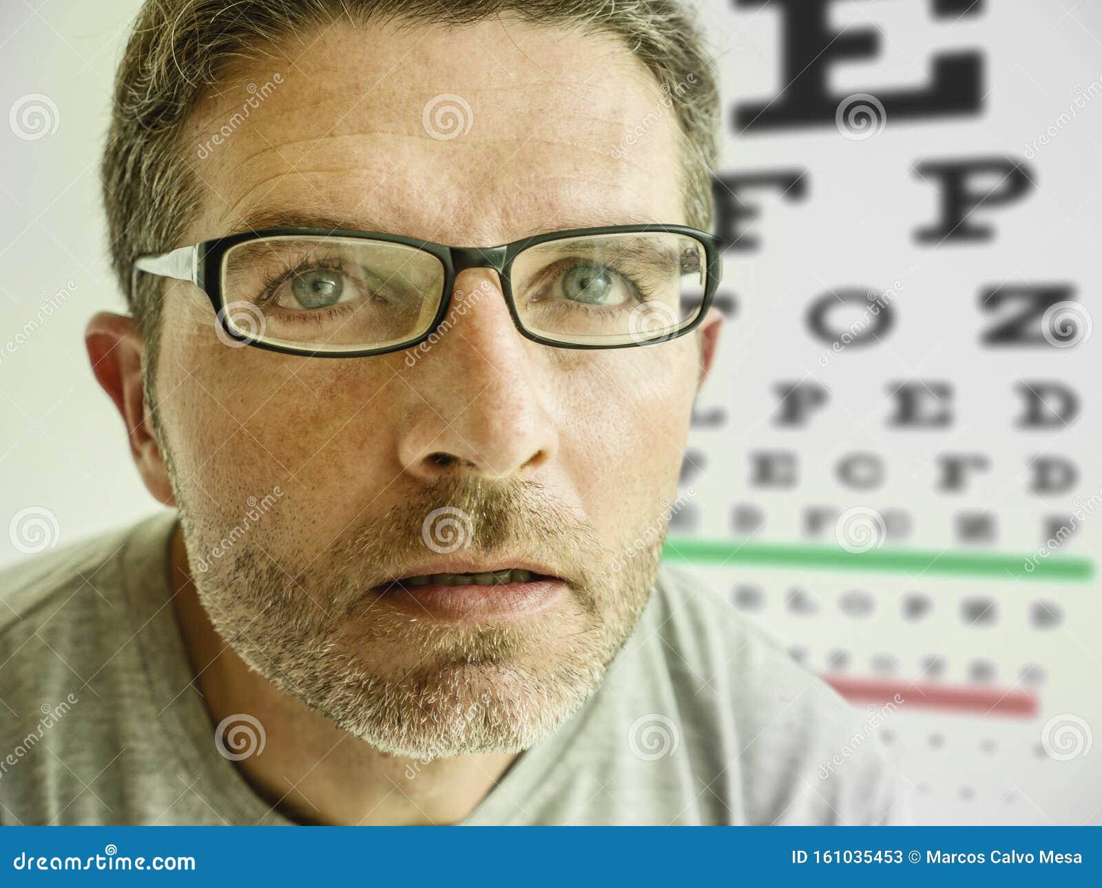 Attractive Man Checking Vision Trying Glasses at Optometrist . Guy on ...