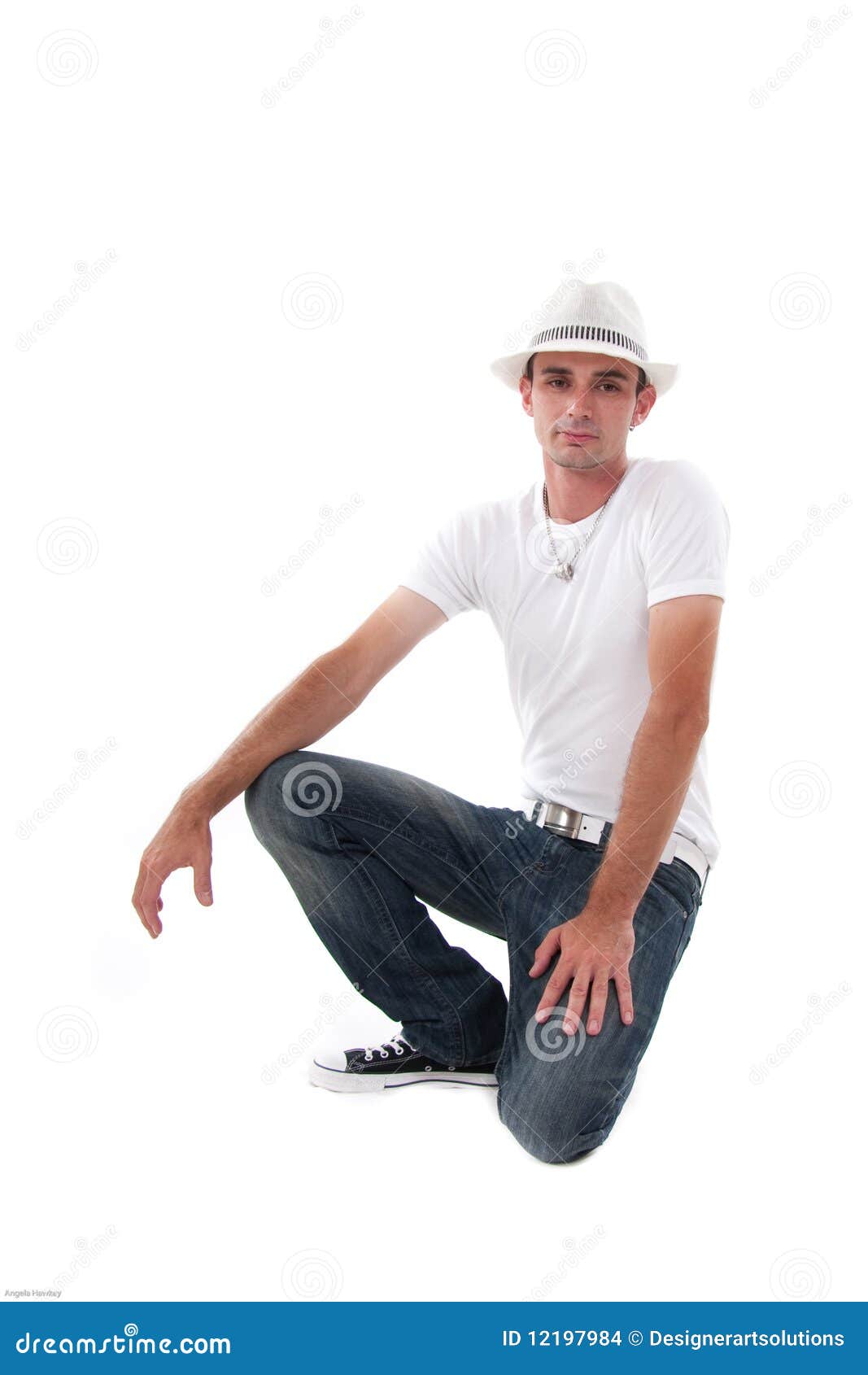 Attractive Man Kneeling stock photo. Image of indoors - 12197984