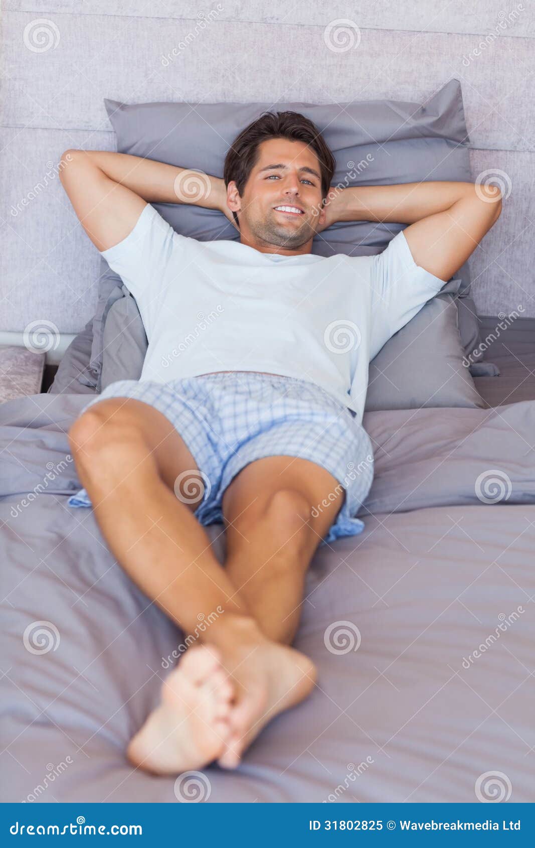Attractive Man Lying in Bed Stock Image - Image of cheerful, home: 31802825