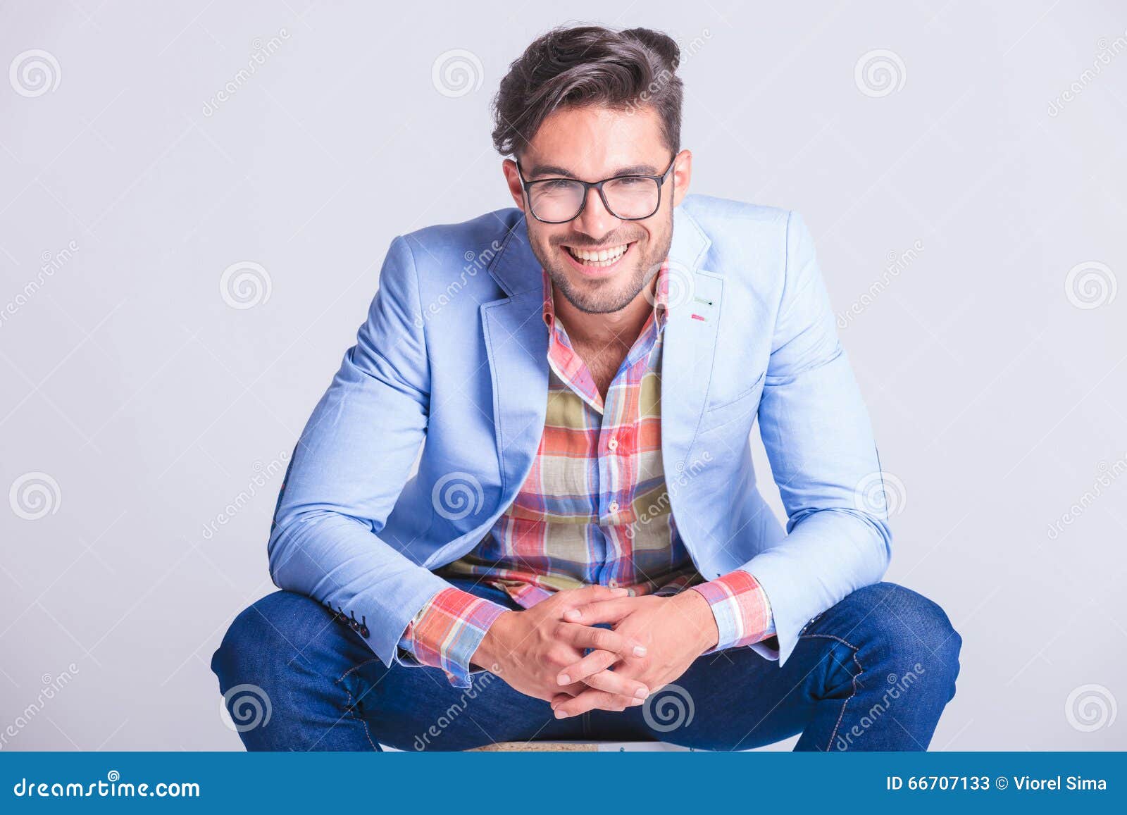 Attractive Man Posing Seated with Legs Spread Open Stock Image - Image ...