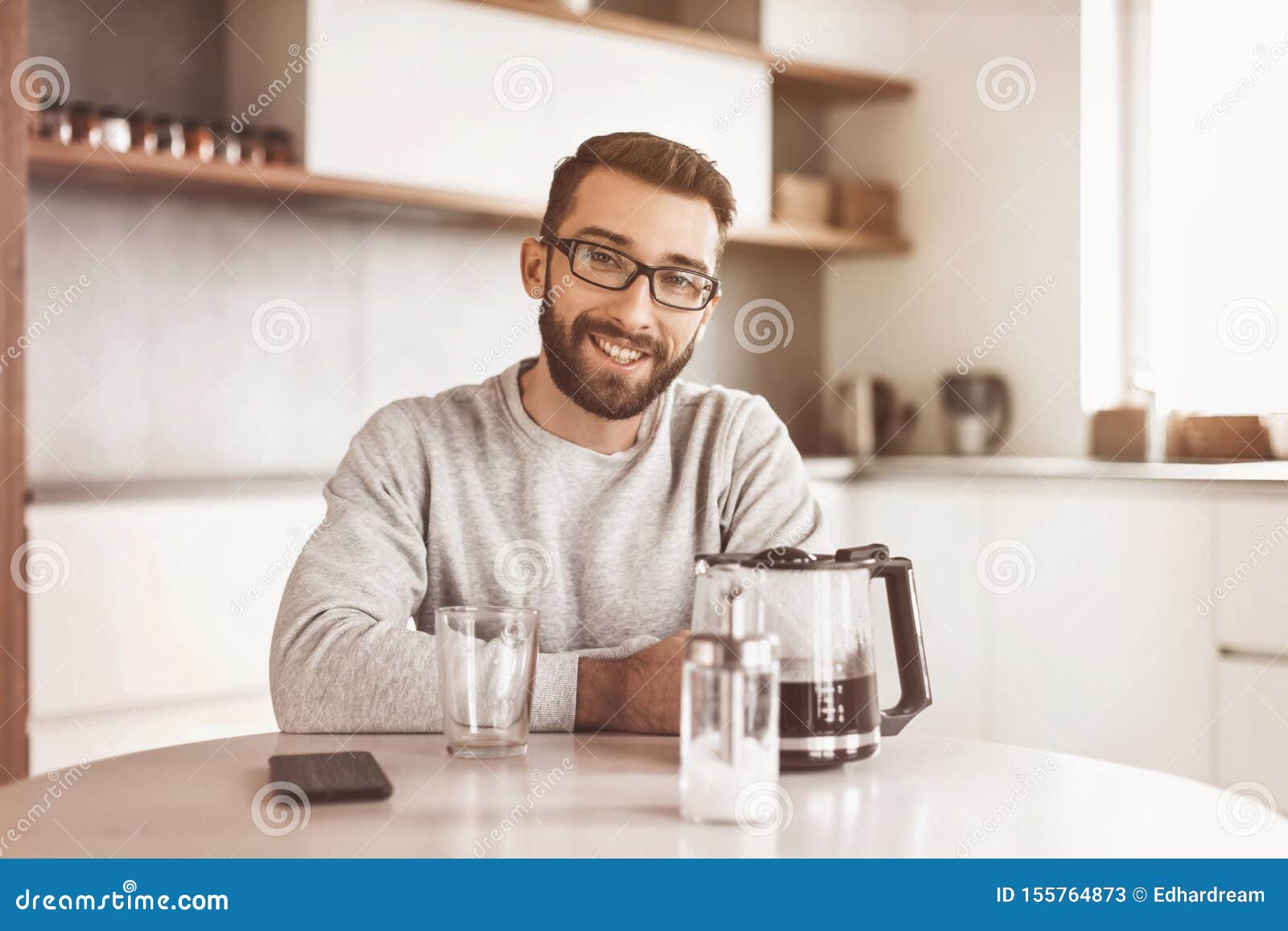 Attractive Man Sitting at the Kitchen Table in the Morning Stock Image ...
