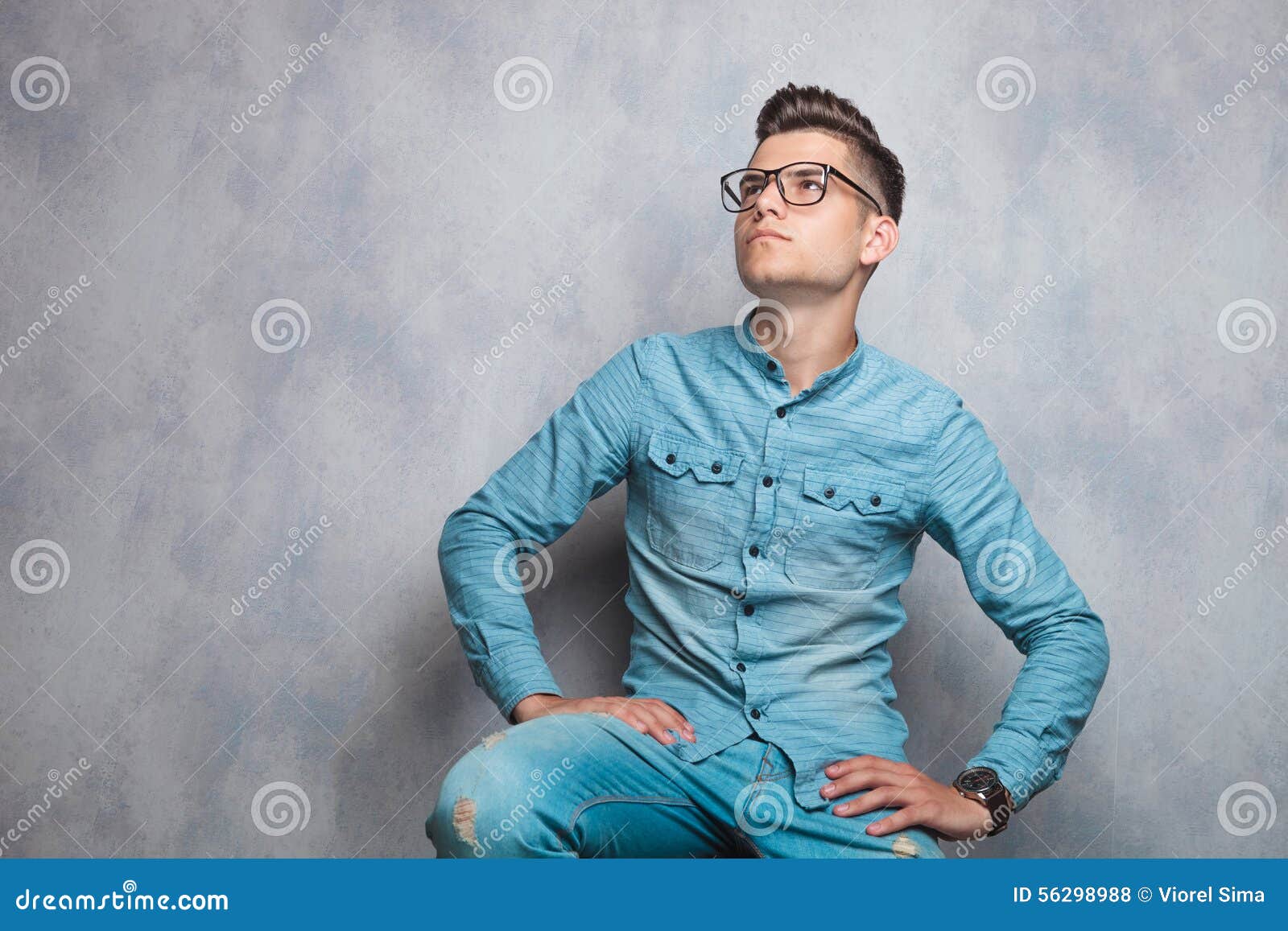 Attractive Man Sitting while Looking Up. Stock Photo - Image of casual ...