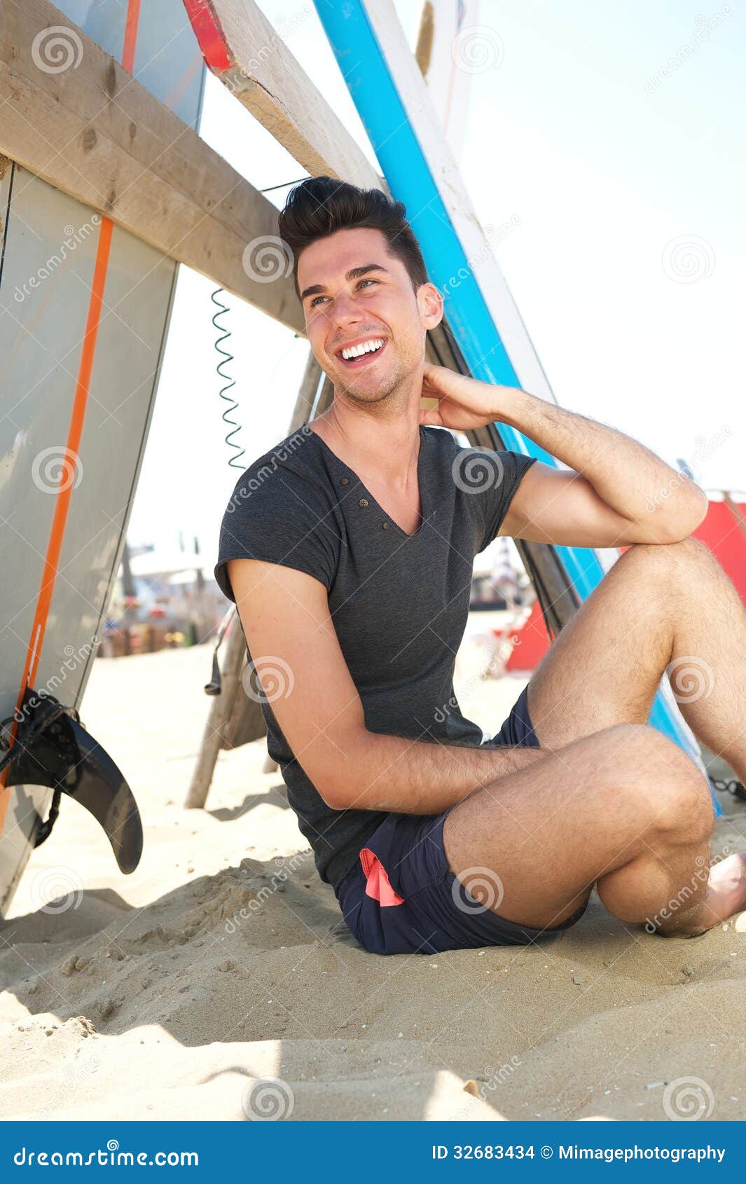 Attractive Man Smiling at the Beach Stock Photo - Image of alone ...