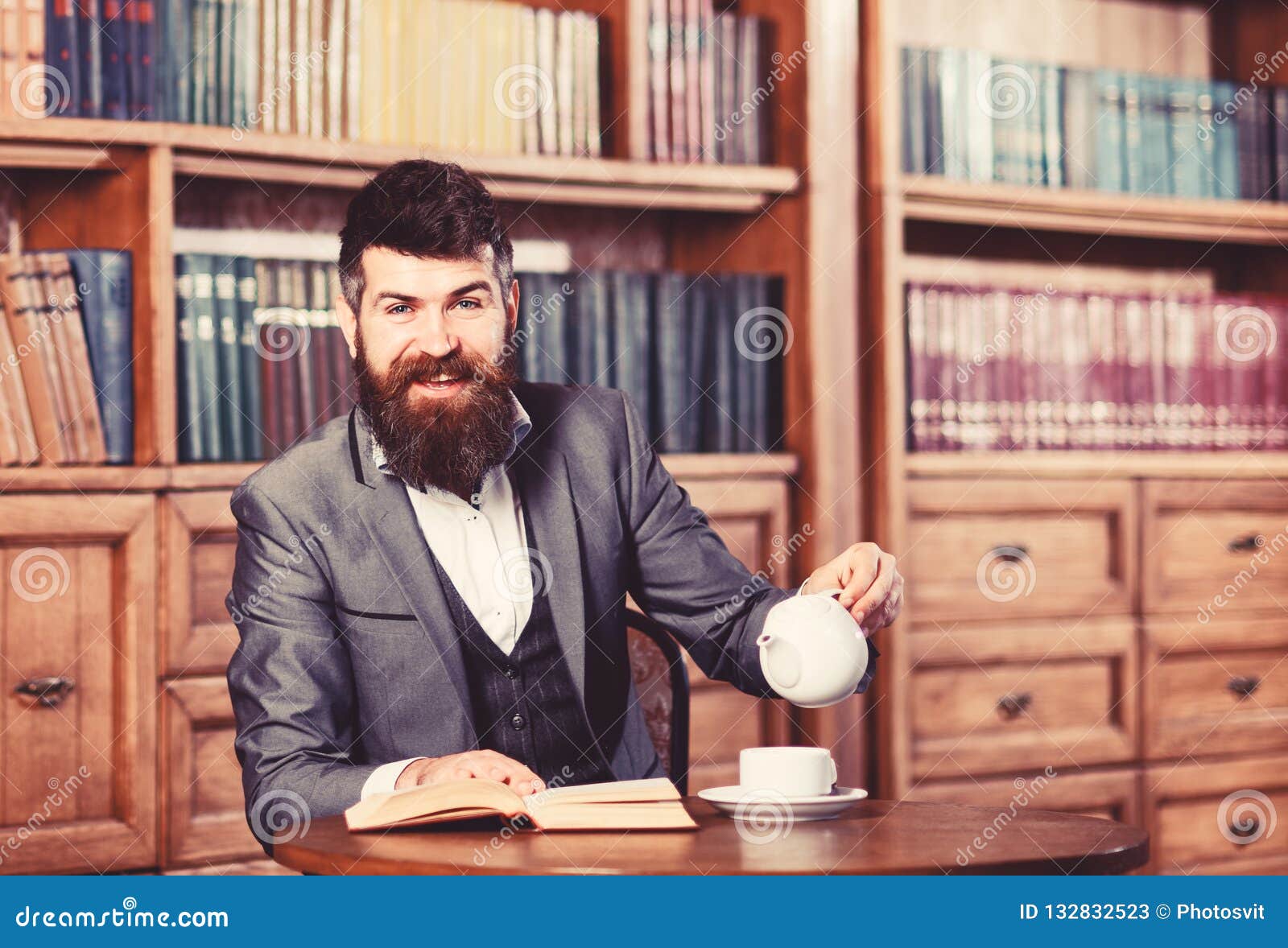 Attractive Man is Studying at the Library Stock Image - Image of ...