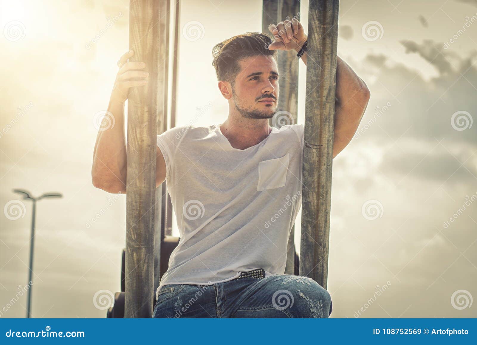 Man in Urban Setting in Front of Big Metal Structure Stock Image ...