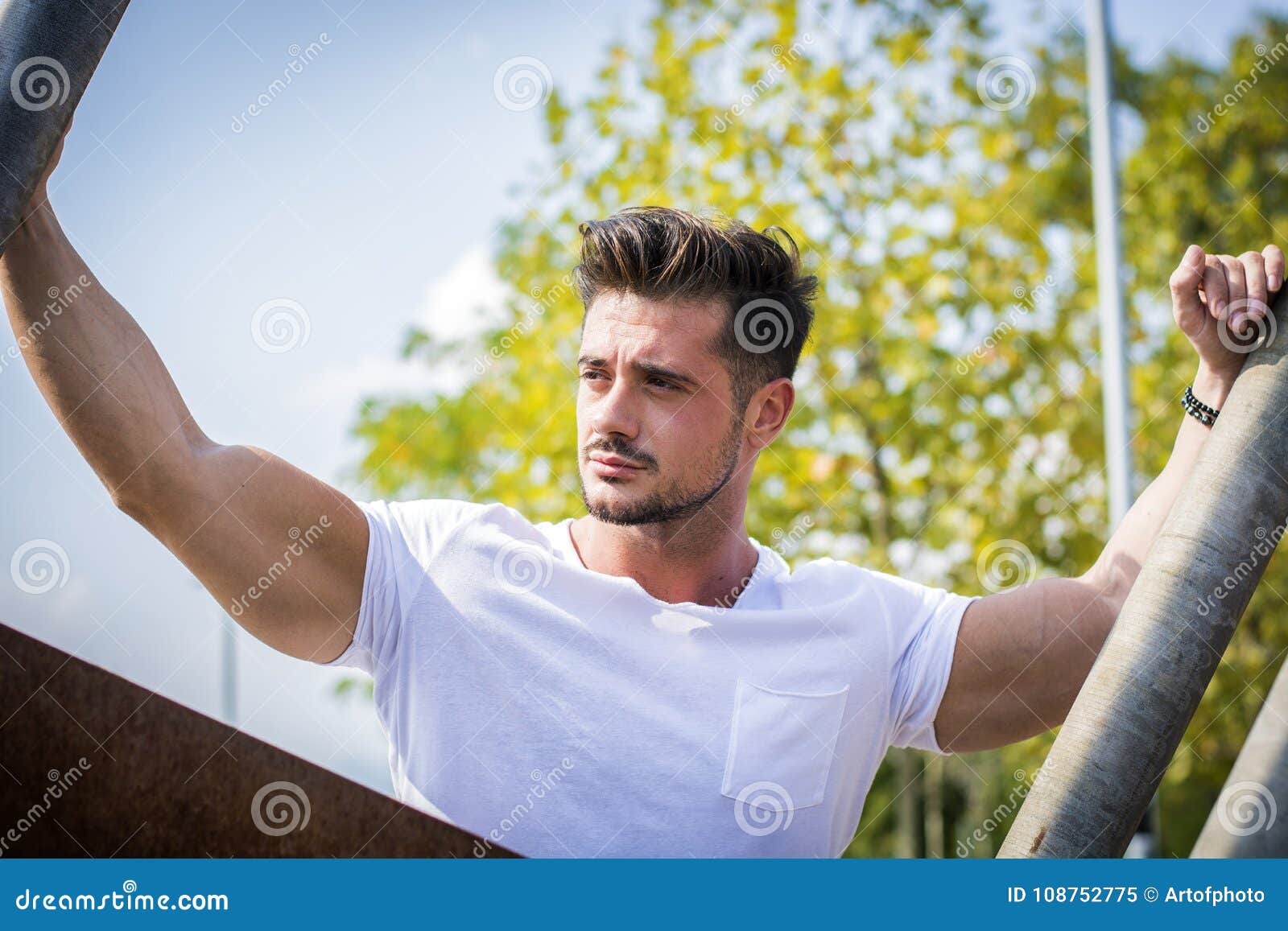 Man in Urban Setting in Front of Big Metal Structure Stock Image ...