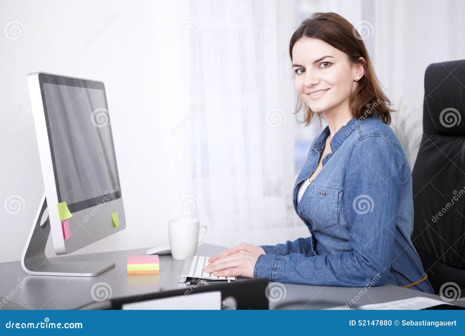Attractive Manageress Working at Her Desktop Stock Photo - Image of ...