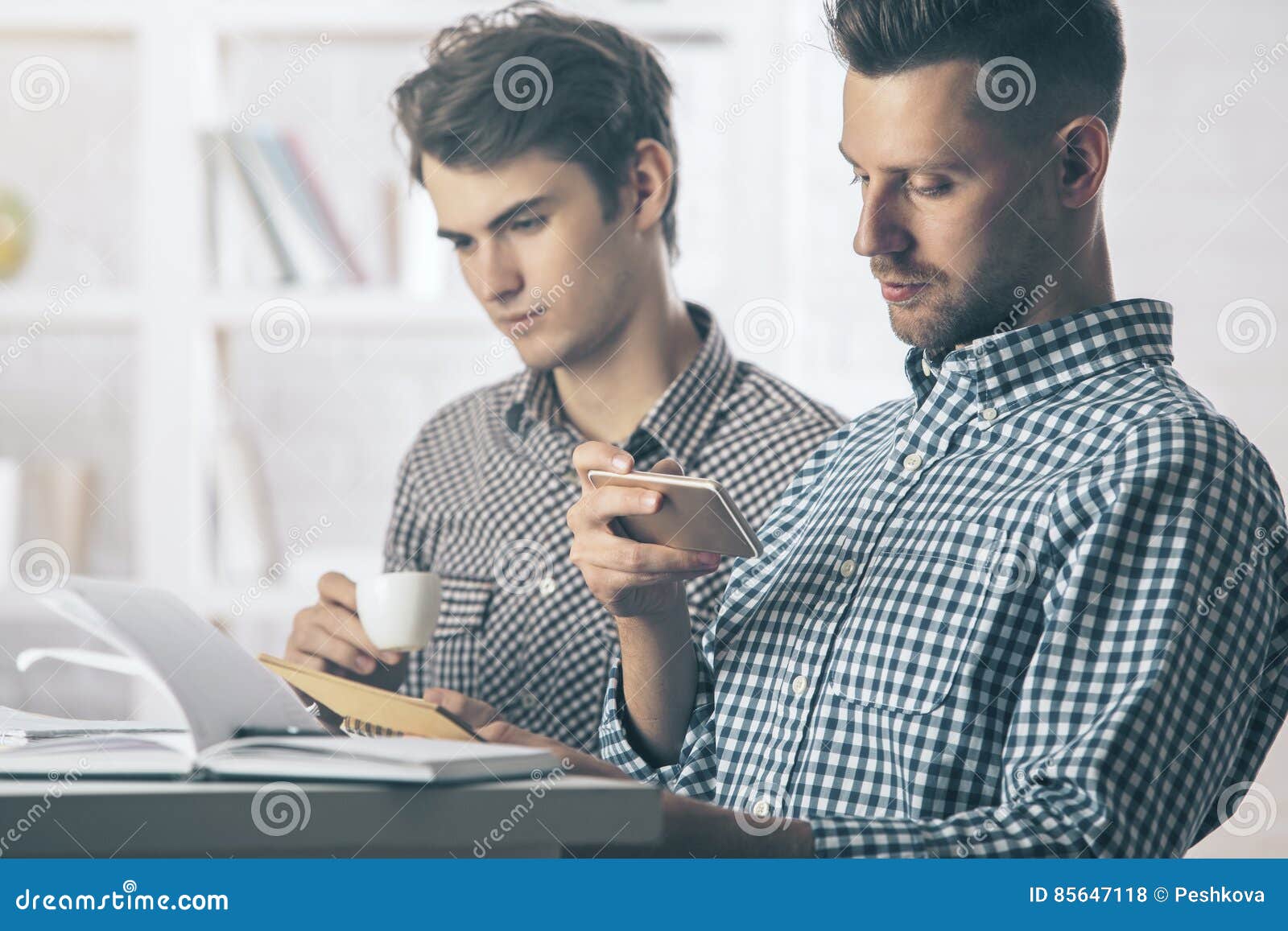 Attractive Men Using Mobile Phone Stock Photo - Image of businessmen ...