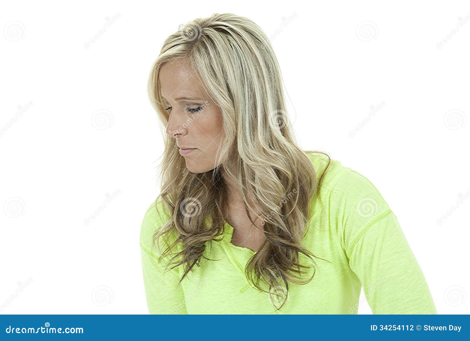 Attractive Model in Green Top Looking Down Thinking Stock Photo - Image ...