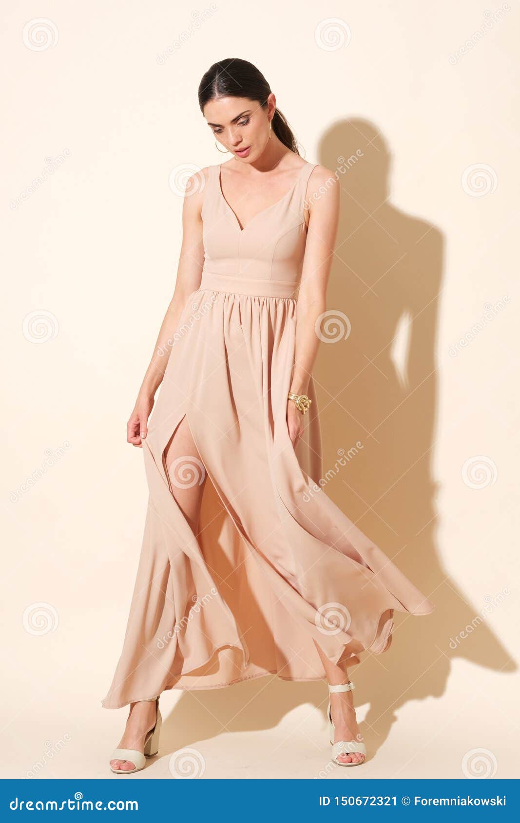 Attractive Model in Long Dress Posing in Studio. Stock Image - Image of ...