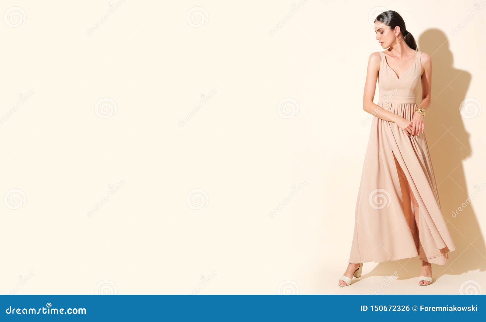 Attractive Model in Long Dress Posing in Studio. Stock Photo - Image of ...