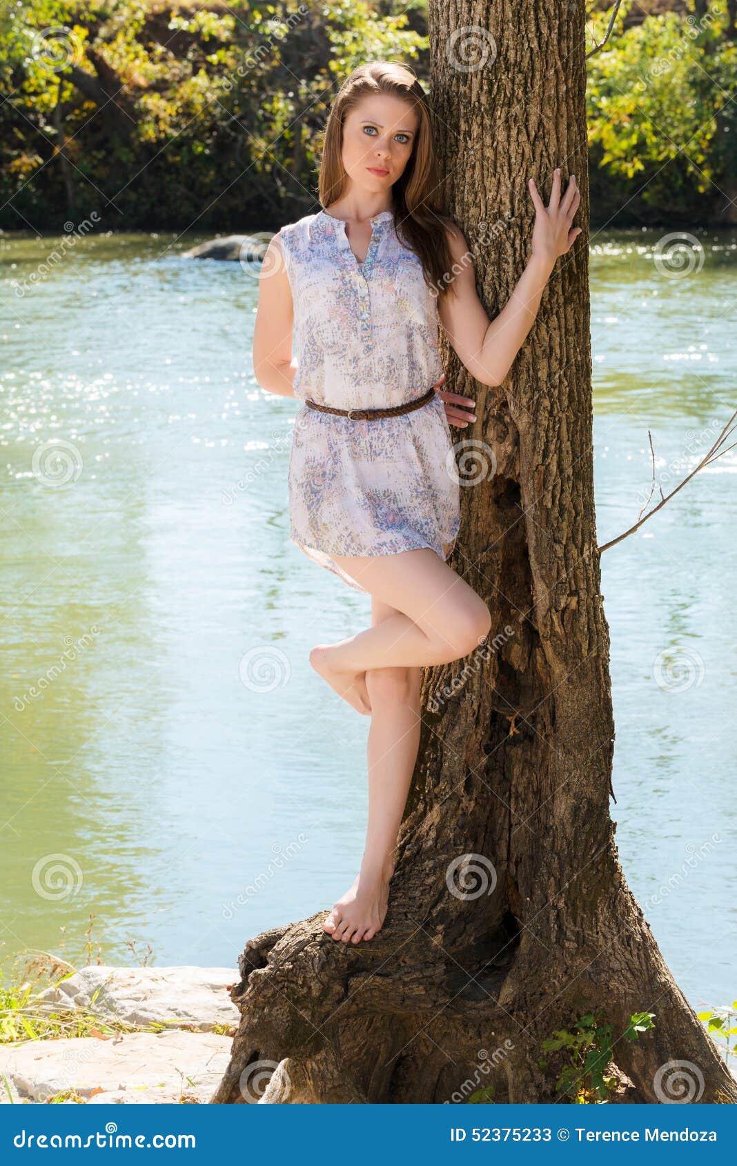 Attractive Model Relaxes by a Tree beside Small River Stock Image ...