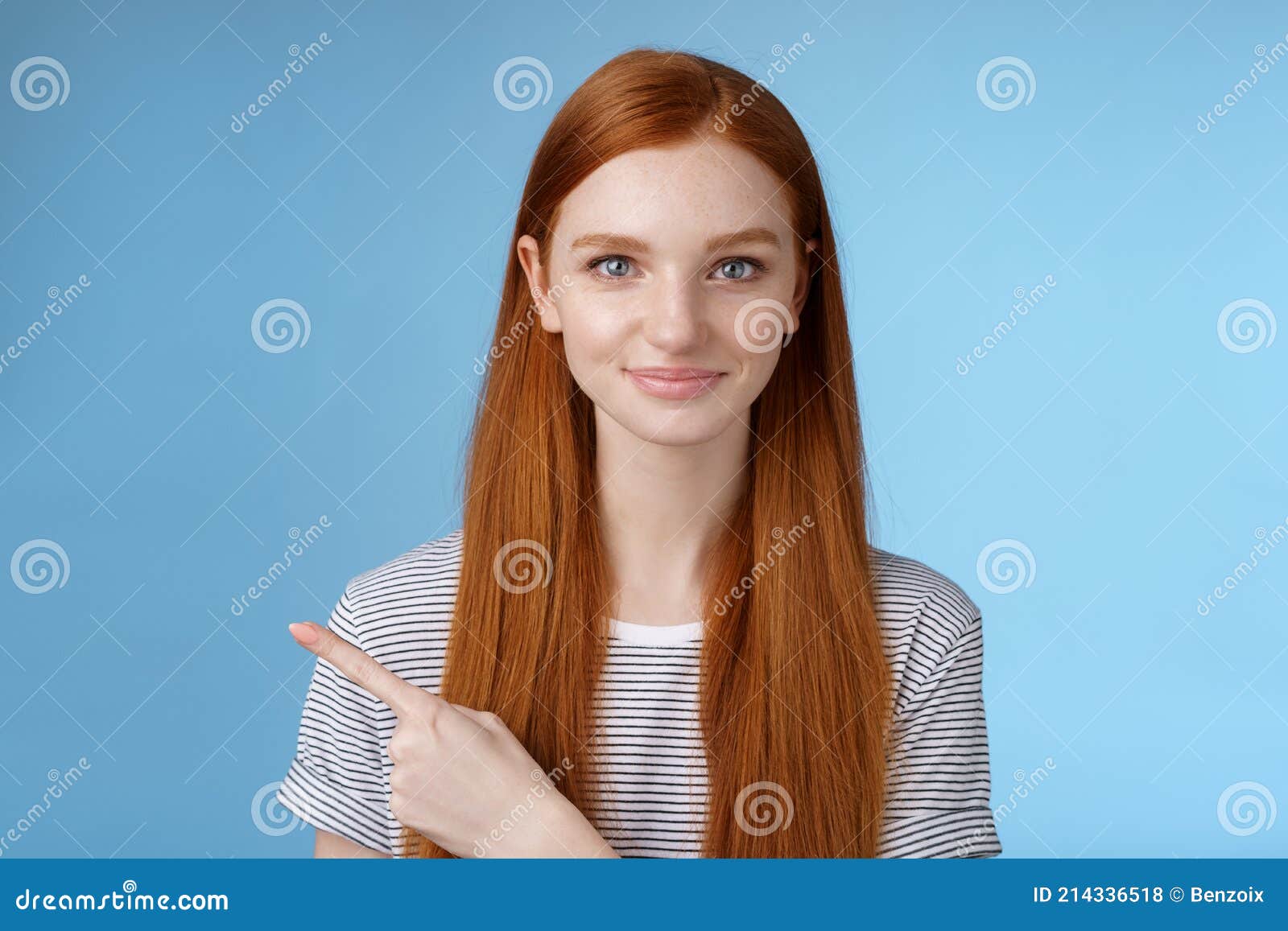 Attractive Modest Good Looking Redhead Girlfriend Acting Mature Friendly Smiling Pointing Left