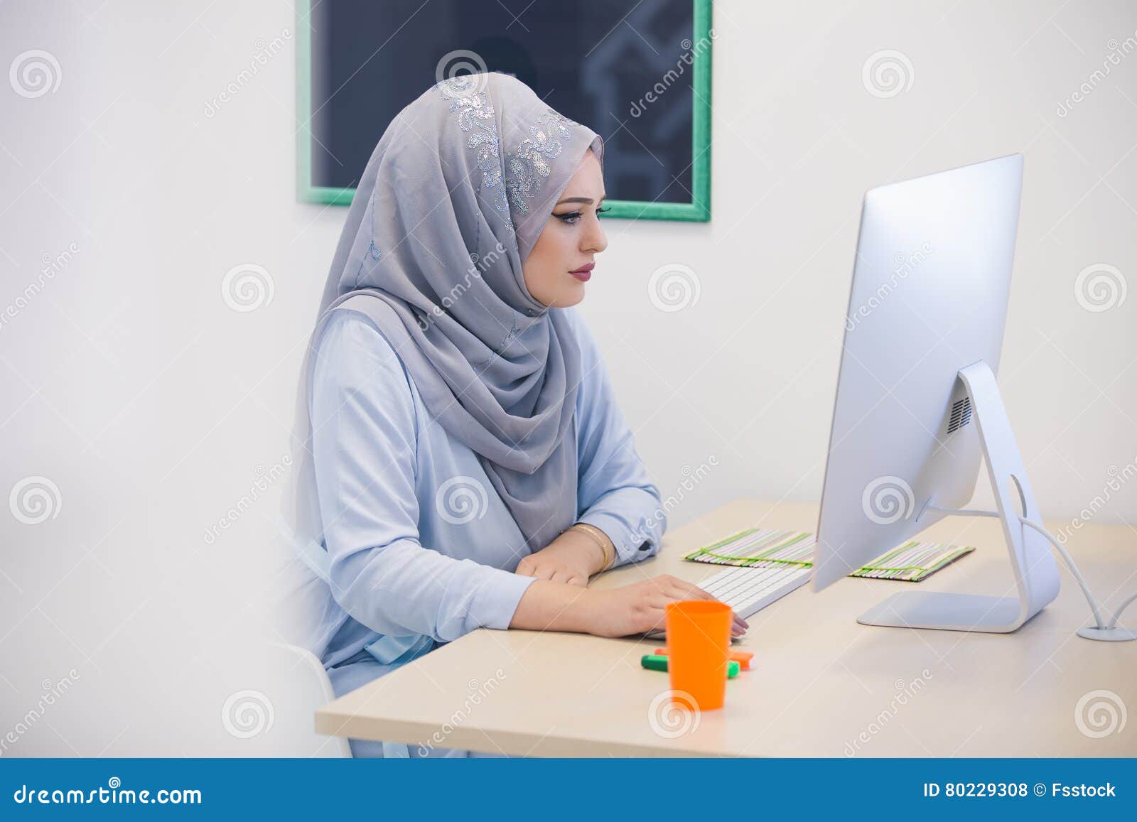 Attractive Muslim Young Woman Working in Office on Computer Stock Photo ...