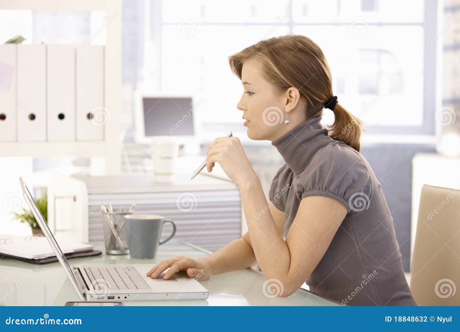 Attractive Office Worker Sitting at Desk Stock Photo - Image of ...