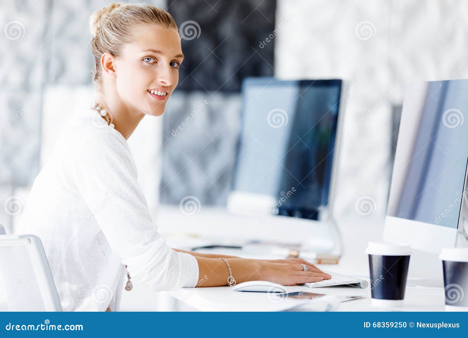 Attractive Office Worker Sitting at Desk Stock Photo - Image of monitor ...