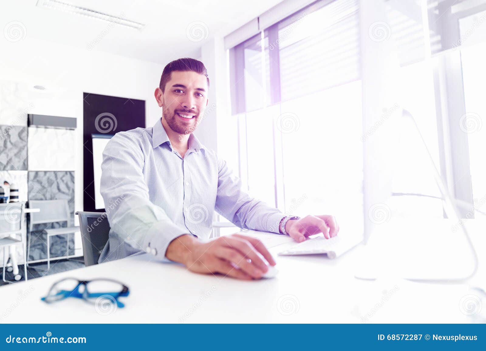 Attractive Office Worker Sitting at Desk Stock Image - Image of modern ...