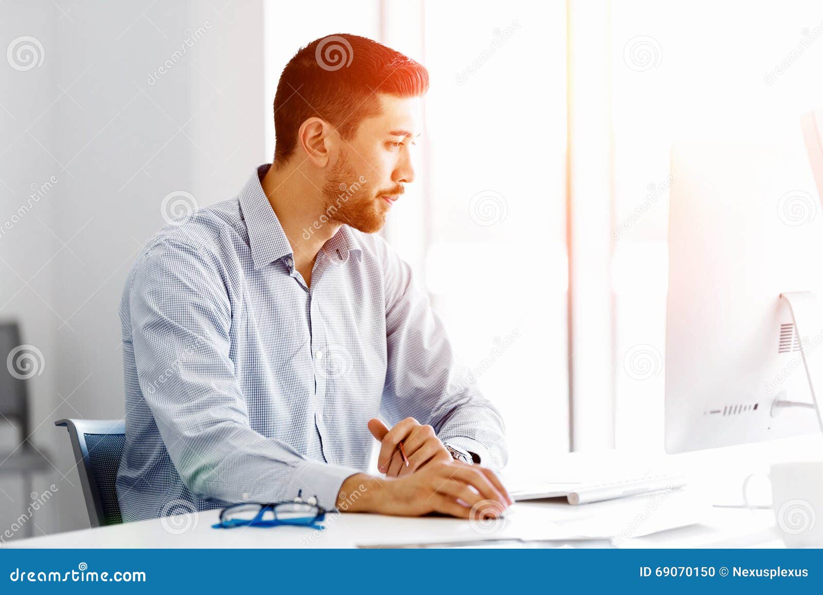 Attractive Office Worker Sitting at Desk Stock Photo - Image of ...