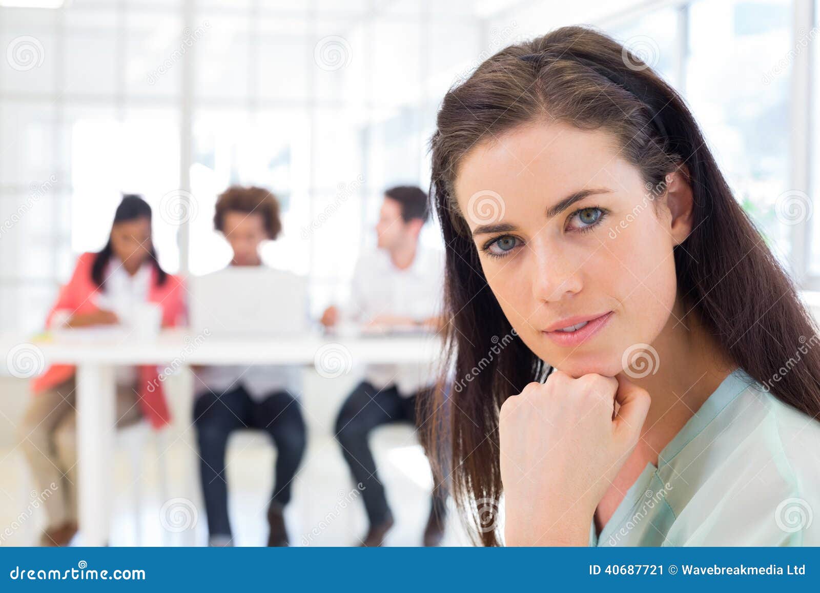 Attractive Office Worker Thinking and Looking at Camera Stock Image ...