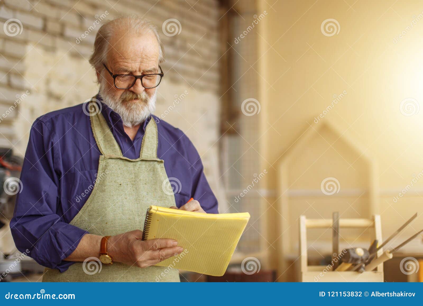 Attractive Old Carpenter Working on Designs in His Workshop Stock Photo ...