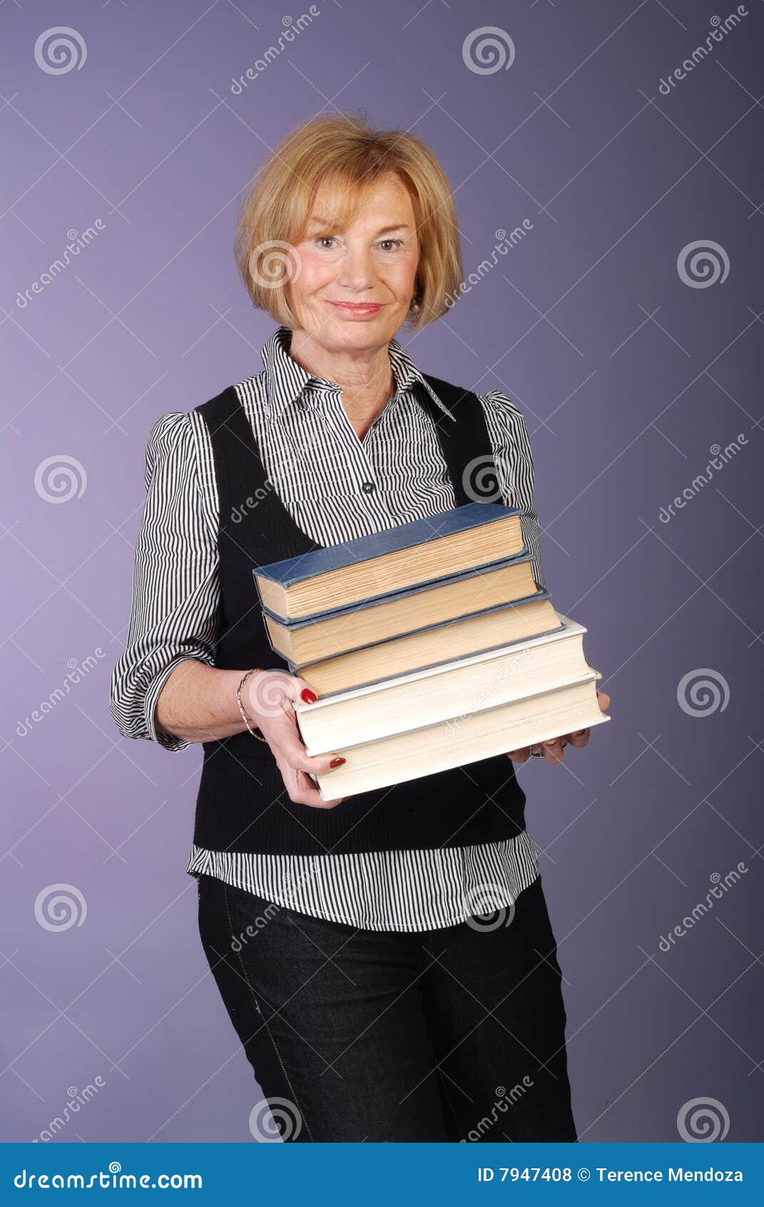 Attractive Older Lady Carrying Stack of Books Stock Photo - Image of ...