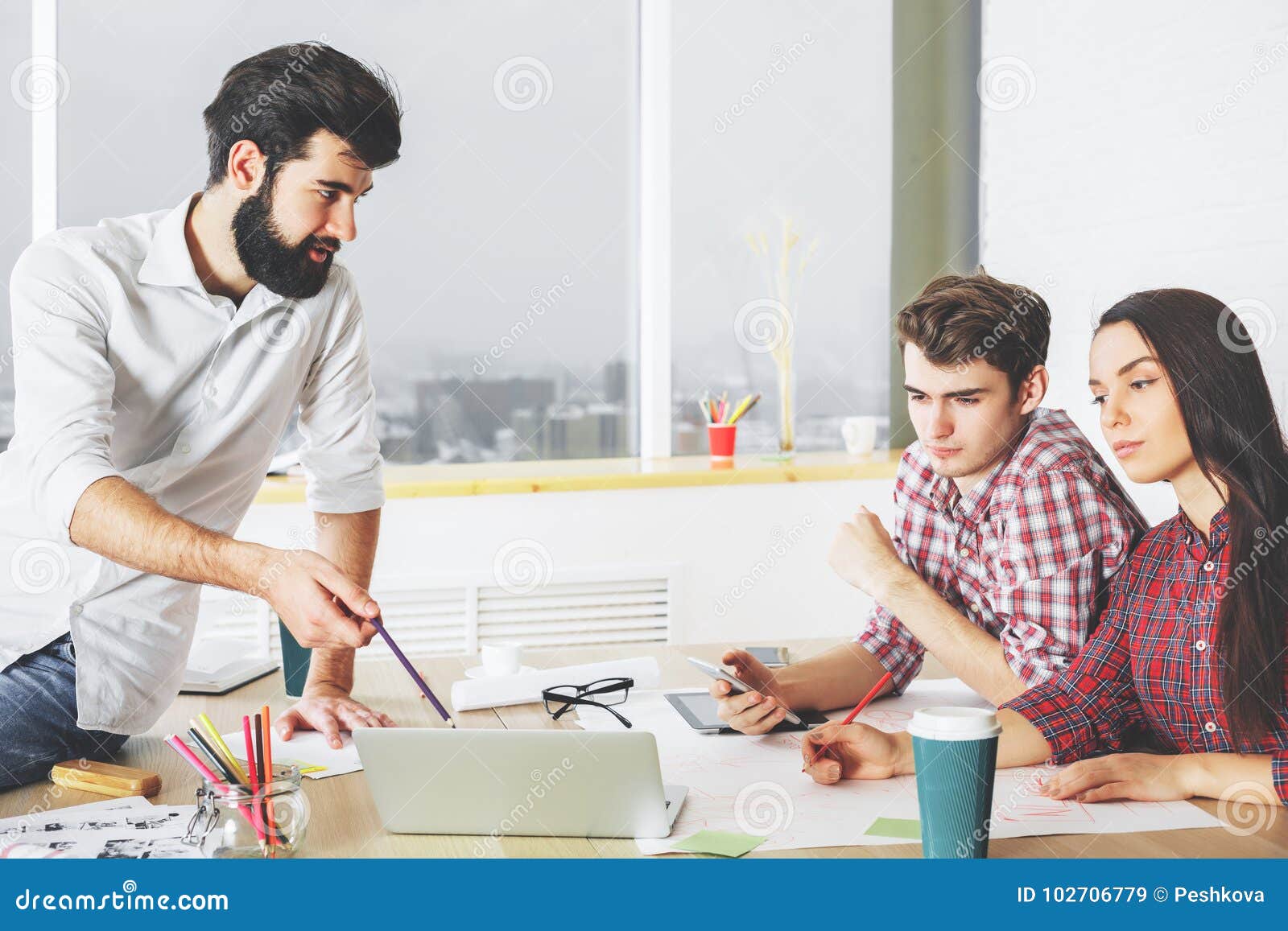 Attractive People Doing Paperwork and Using Devices Stock Image - Image ...