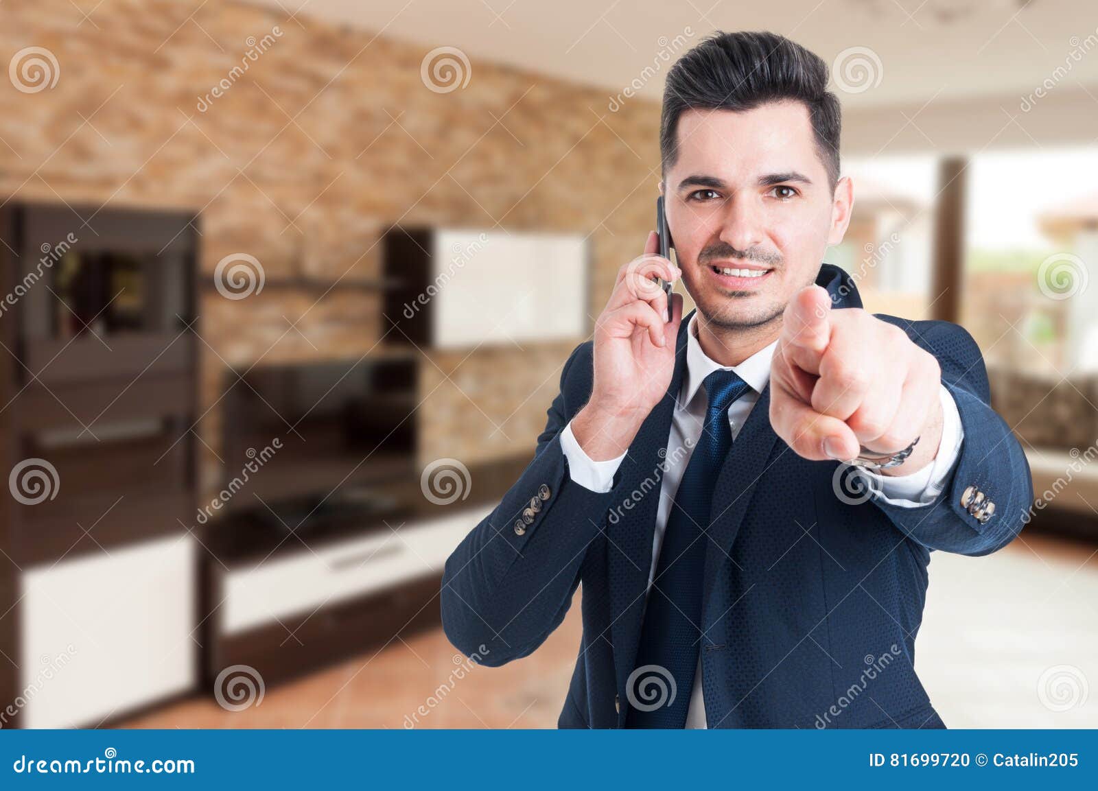 Attractive Realtor Having a Conversation on Cellphone Stock Photo ...