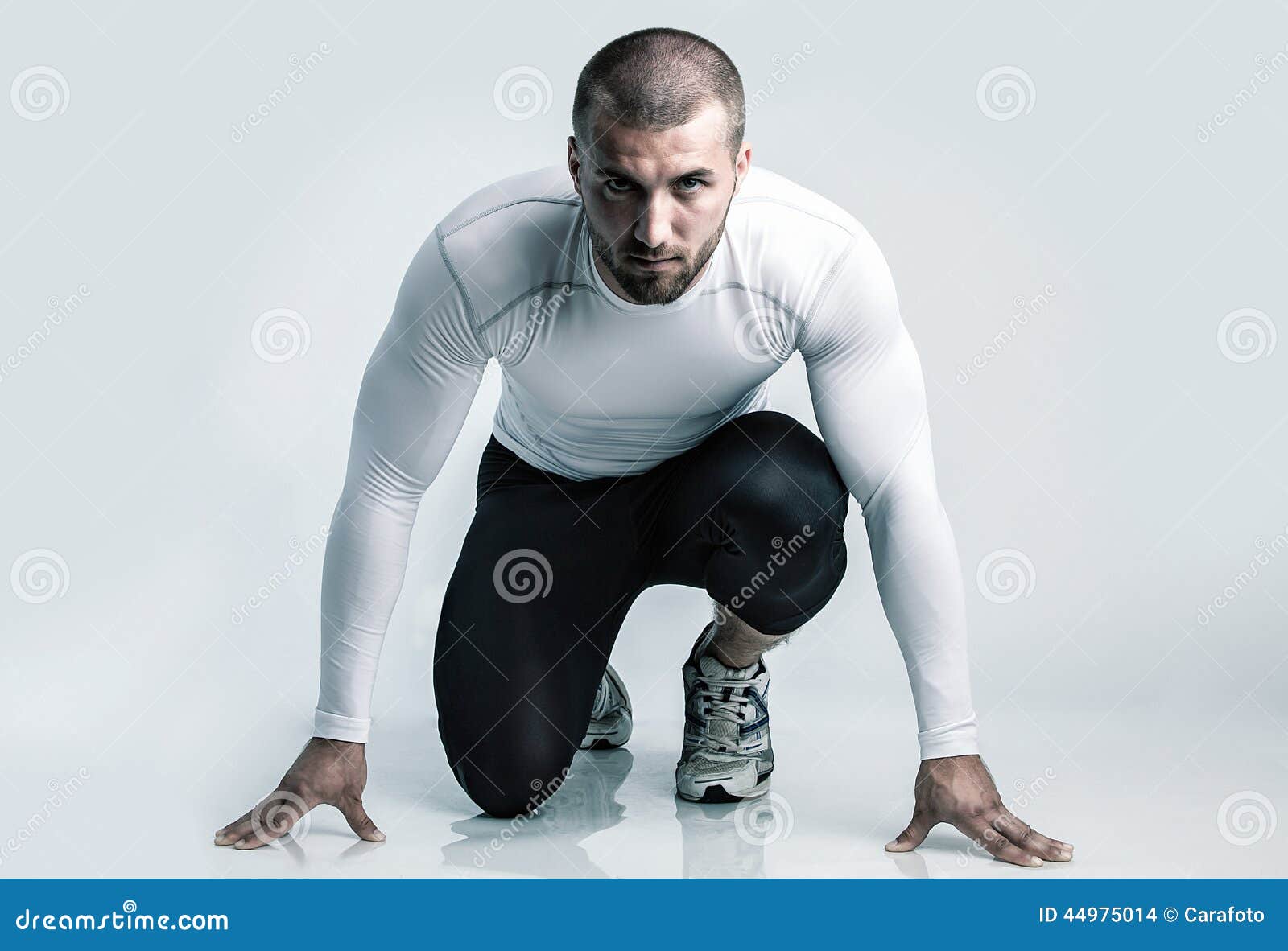 Attractive Runner in Starting Position Stock Photo - Image of clothing ...