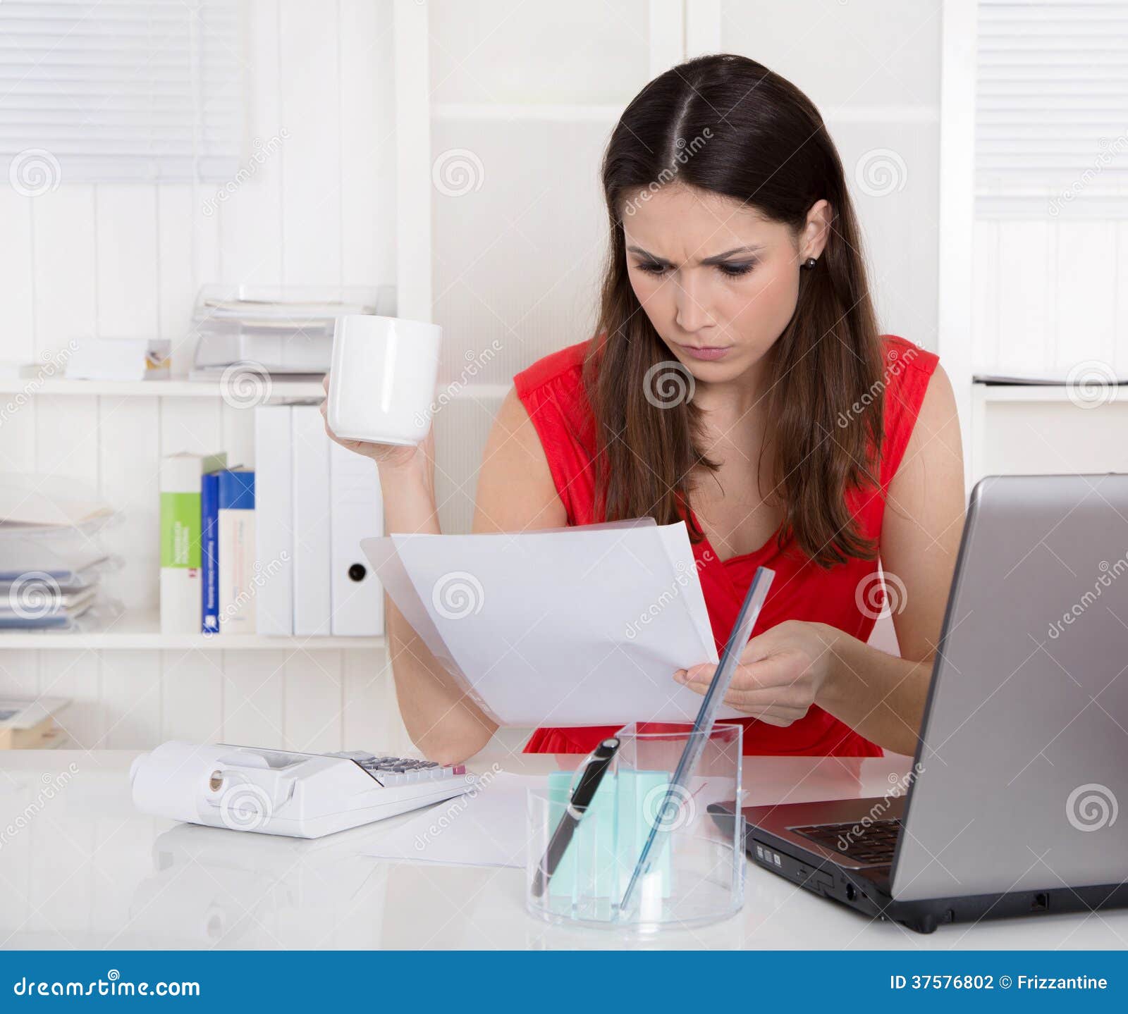 Attractive Secretary Looking at Document at Office. Stock Photo - Image ...