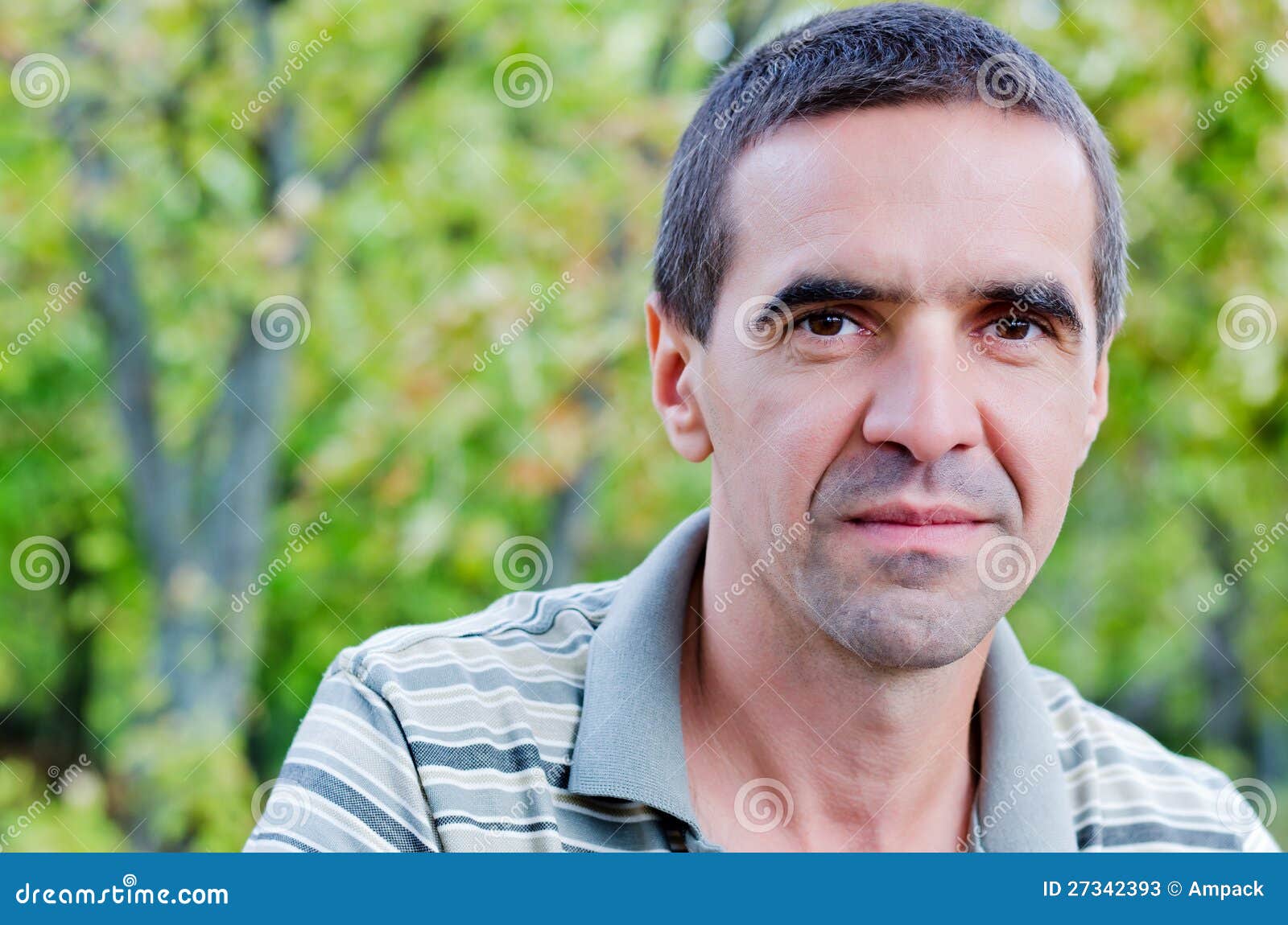 Attractive serious man stock image. Image of greenery - 27342393