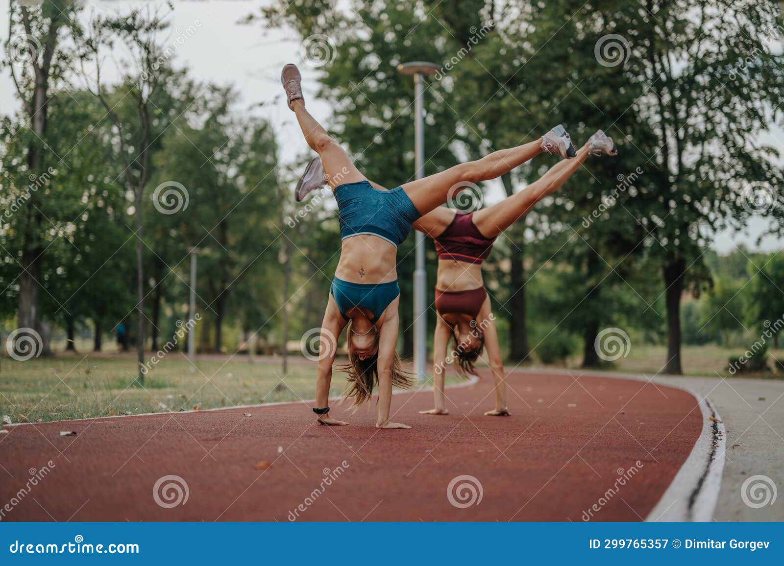 Two Athletic Sisters Performing 360-degree Flips in a Park, Showcasing ...