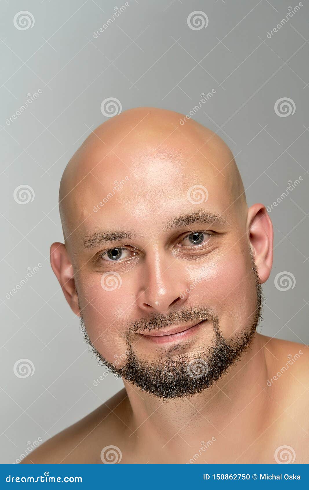 Attractive Smiling Bald Man on Gray Background in Studio Stock Photo ...