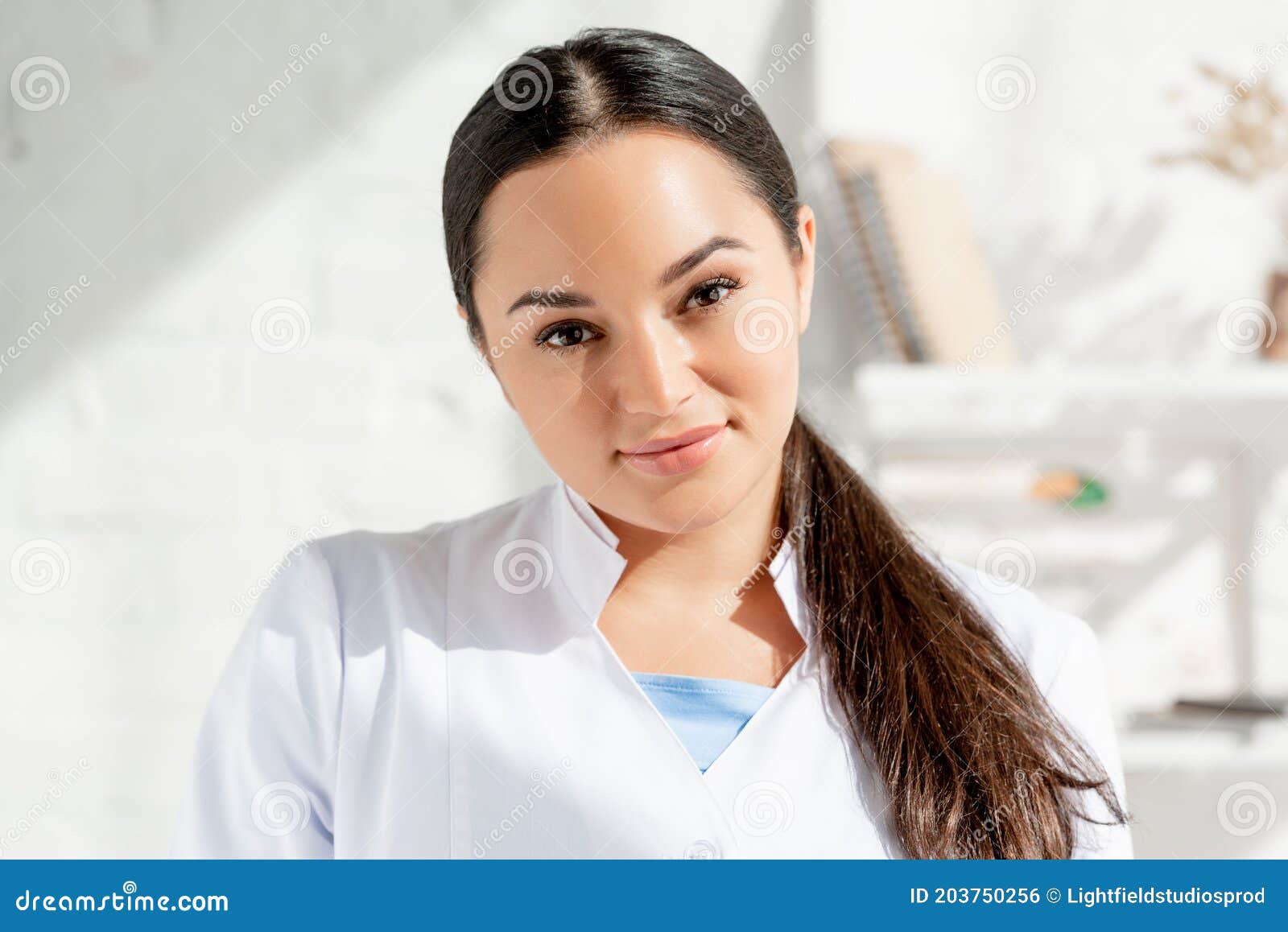 Attractive and Smiling Dermatologist Looking at Stock Photo - Image of ...