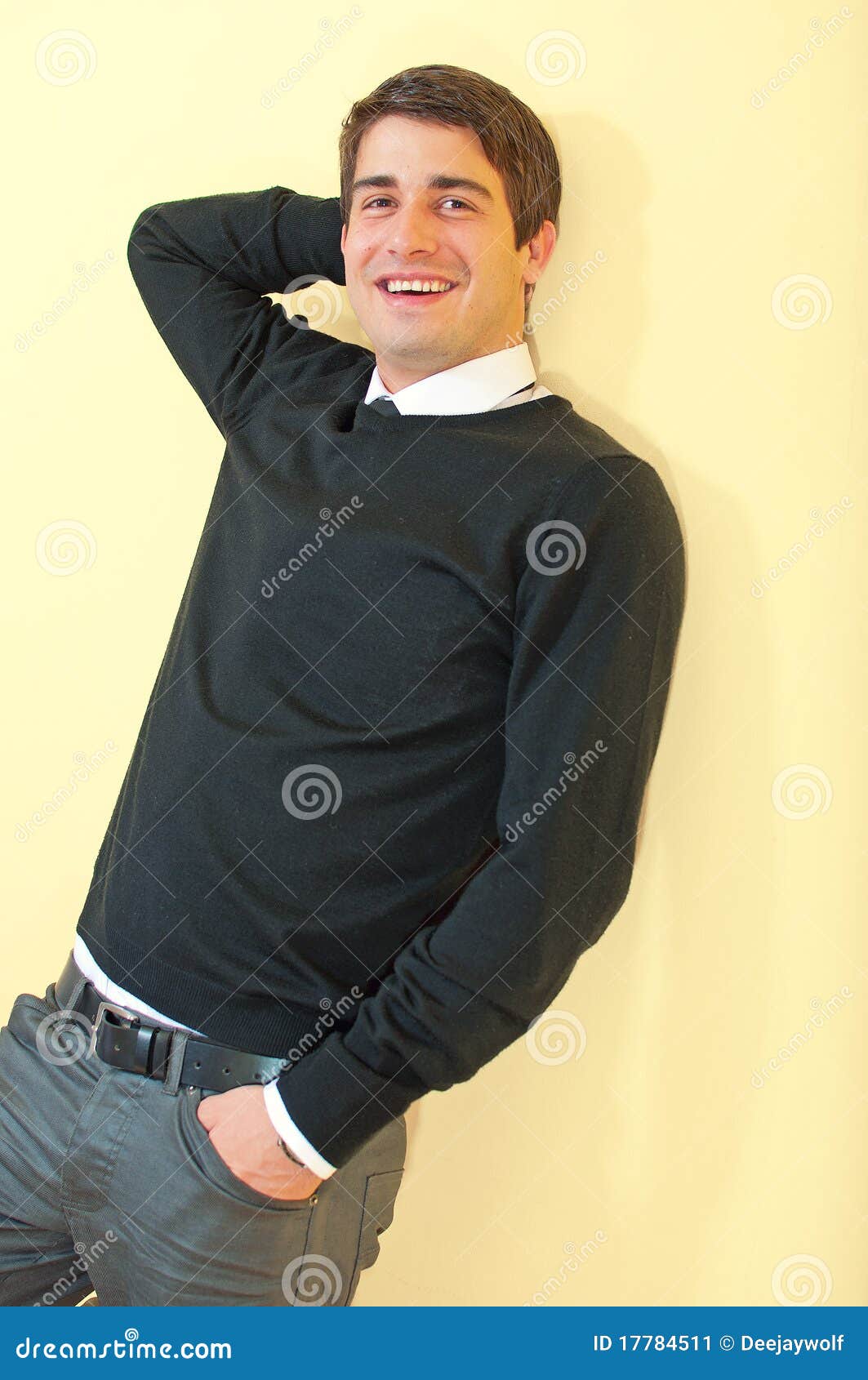 Attractive Smiling Man Posing Against the Wall Stock Image - Image of ...