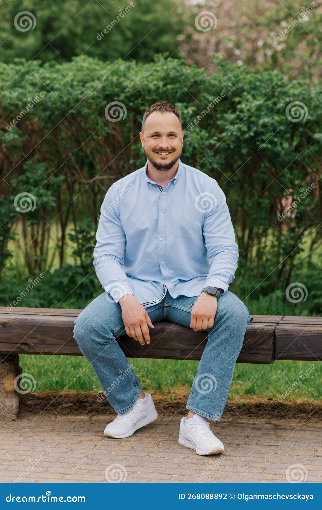 Attractive Smiling Man Sitting Alone on a Park Bench Stock Photo ...