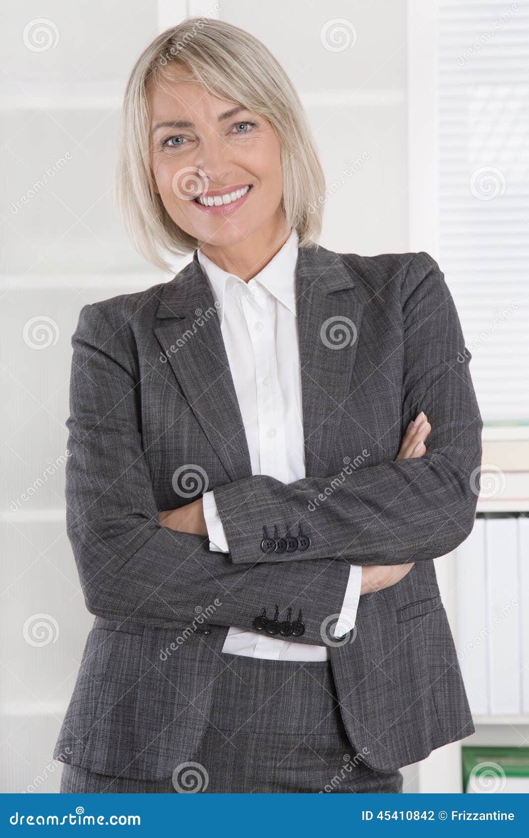 Attractive Smiling Middle Aged Businesswoman In Portrait Wearing Stock