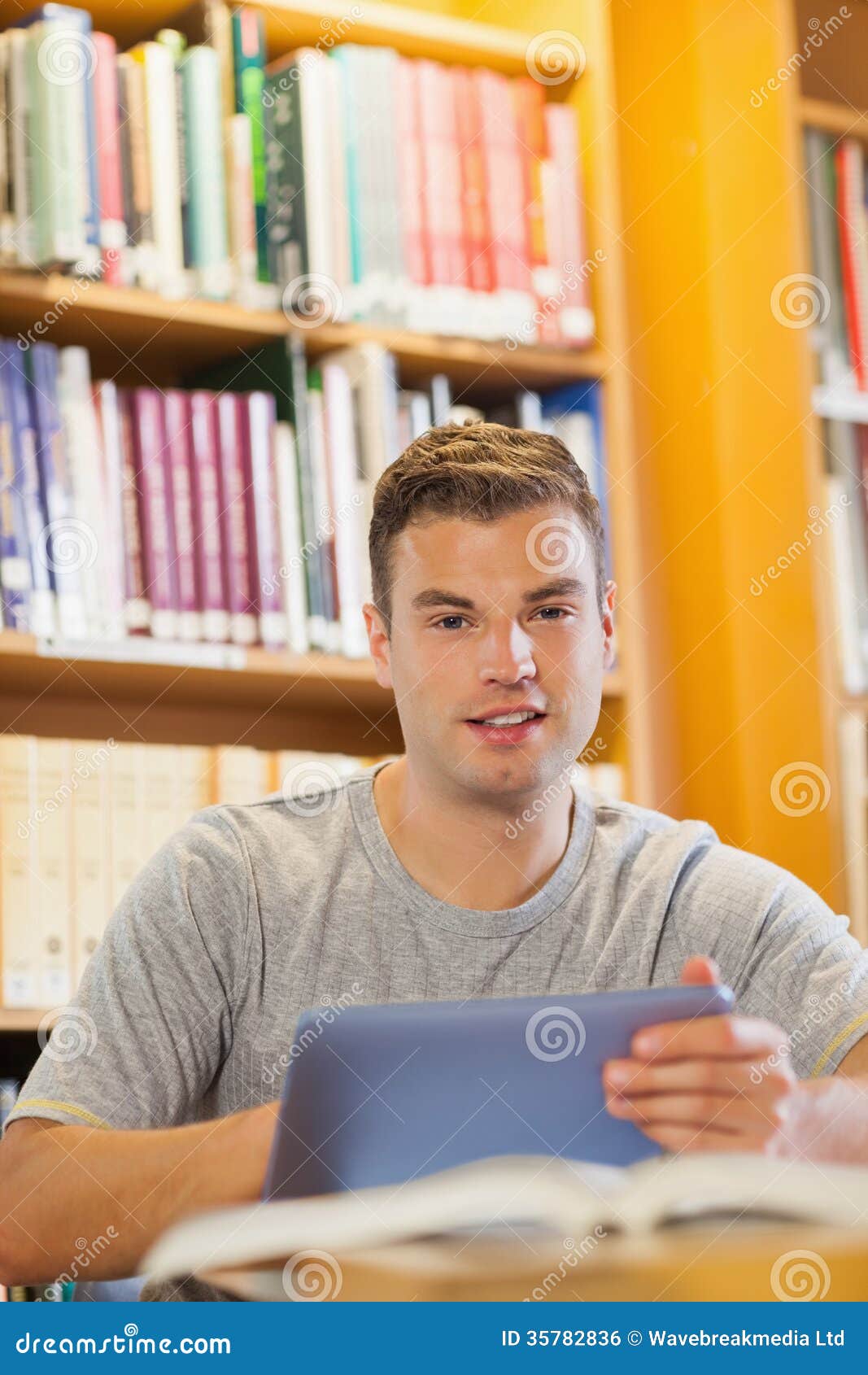 Attractive Smiling Student Using Tablet Stock Photo - Image of book ...