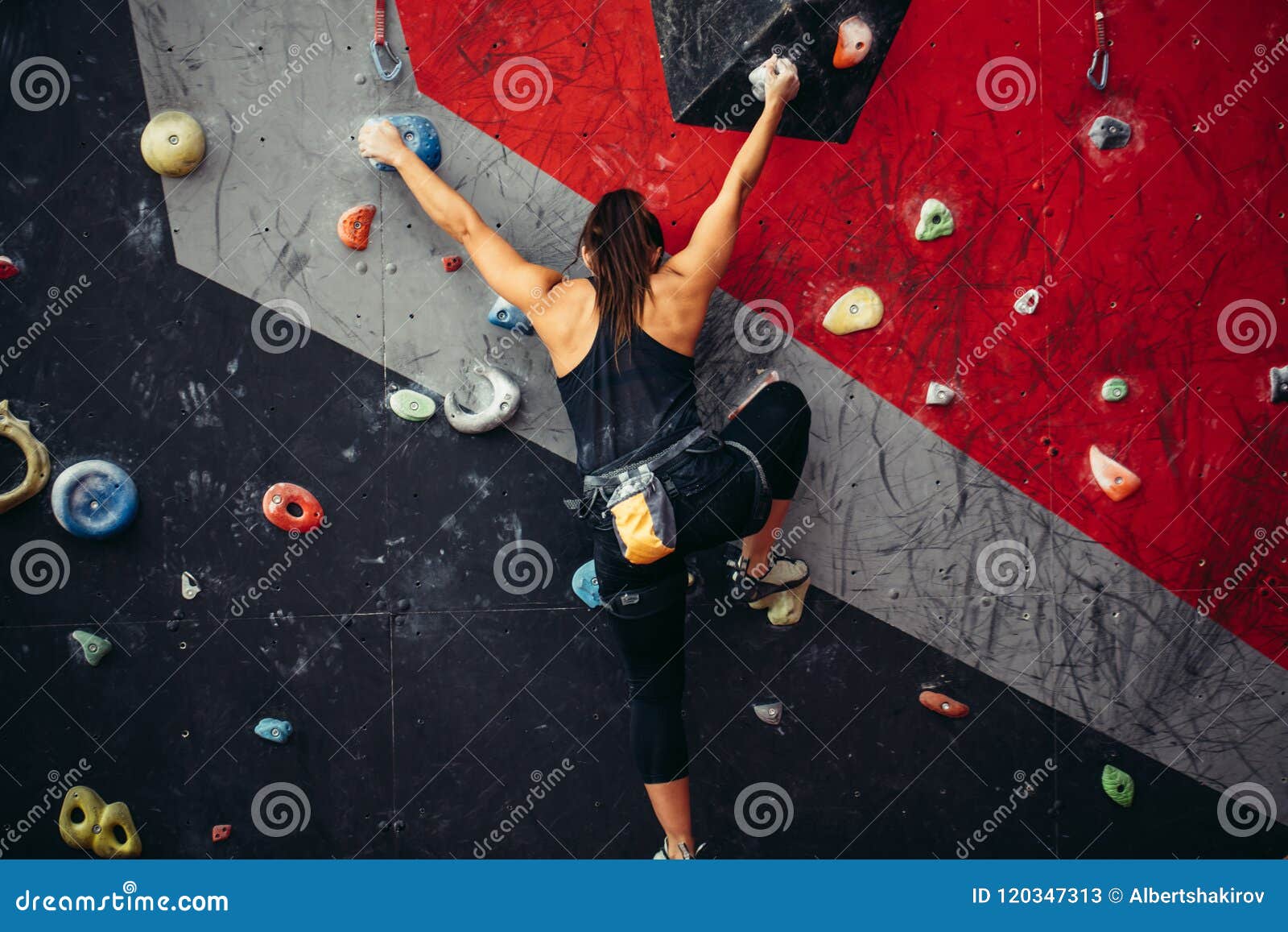 Beautiful Young Woman Taking a Big Step Up an Artificial Wall Stock ...