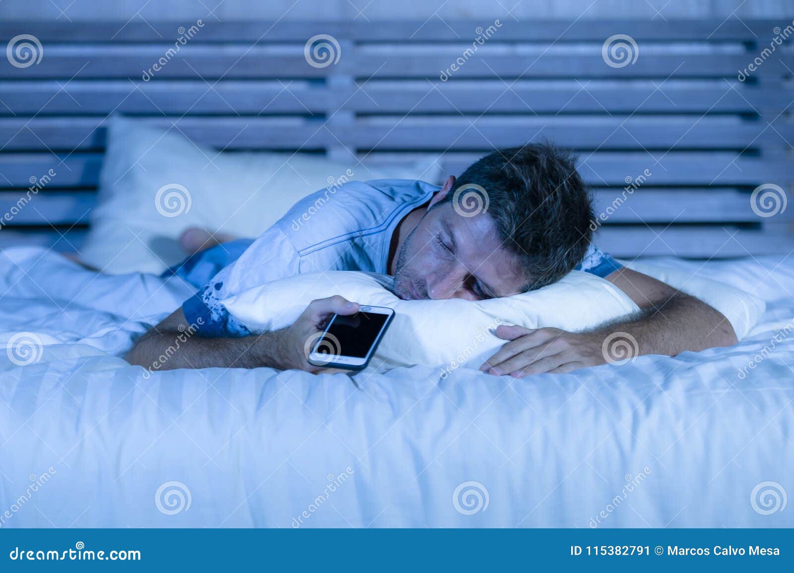 Attractive Tired Man in Bed Falling Asleep while Using Mobile Phone ...