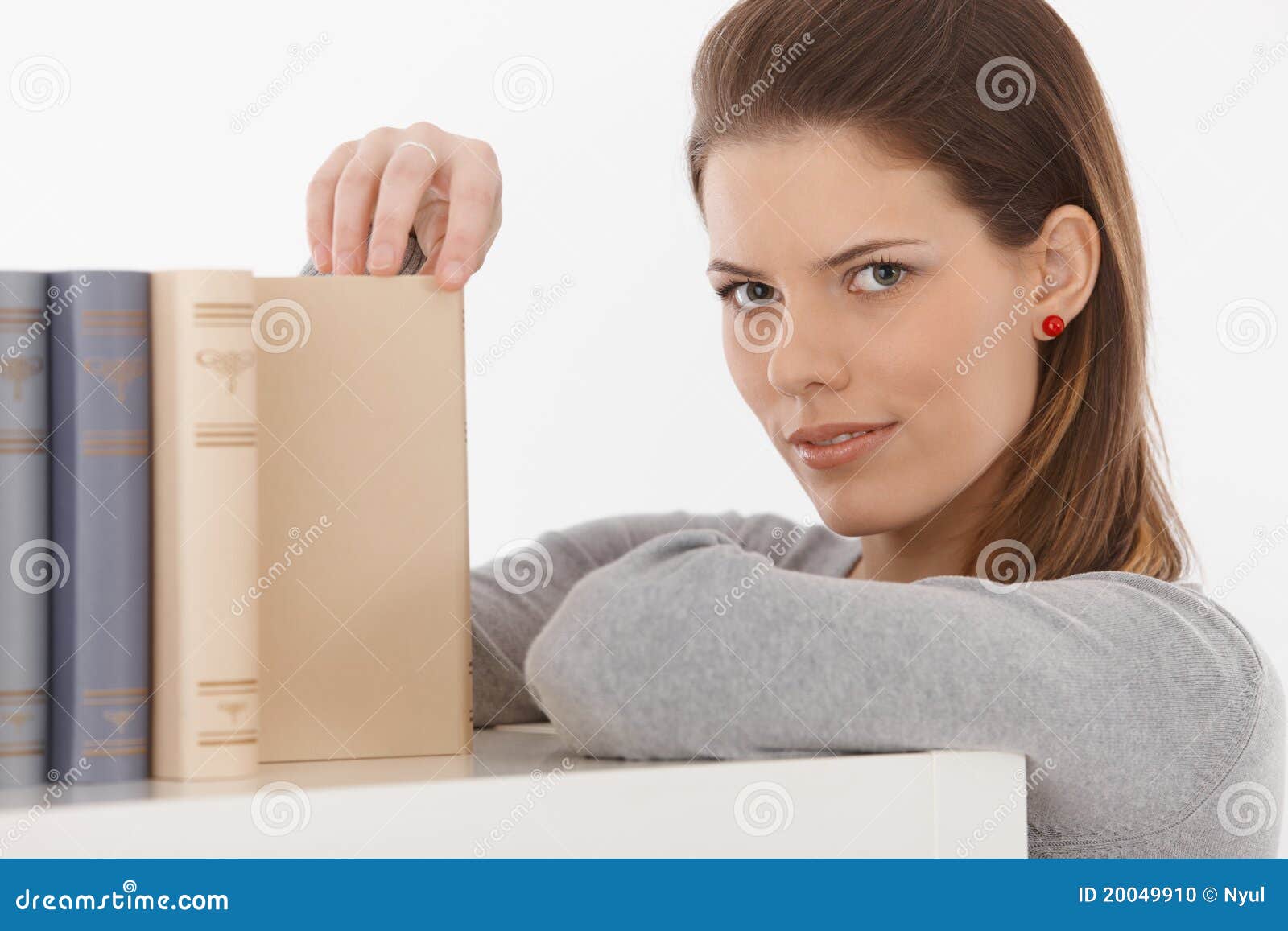 Attractive Woman with Books Stock Photo - Image of indoors, cosy: 20049910