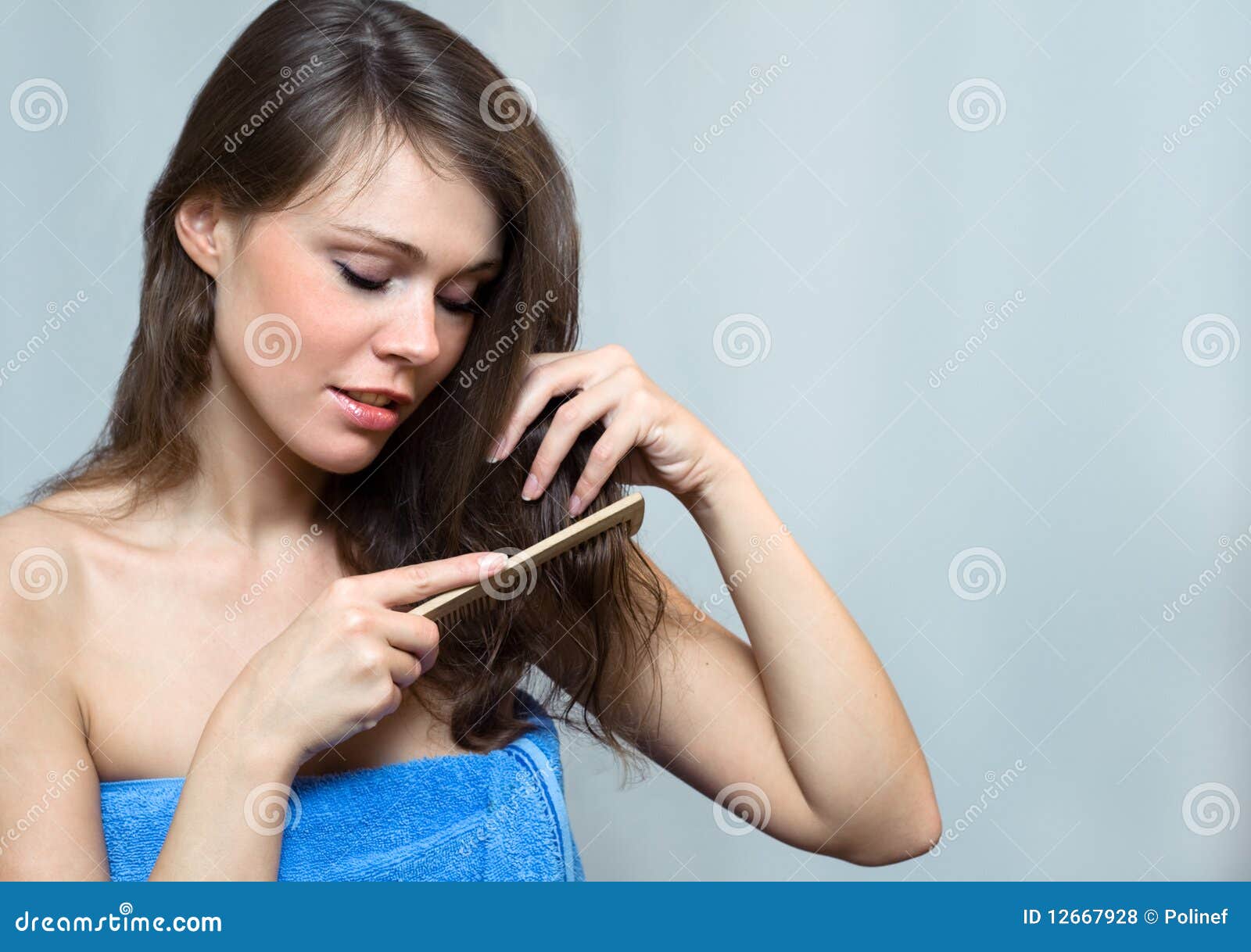 Attractive Woman Combing Her Hair Stock Photo - Image of hair, human ...