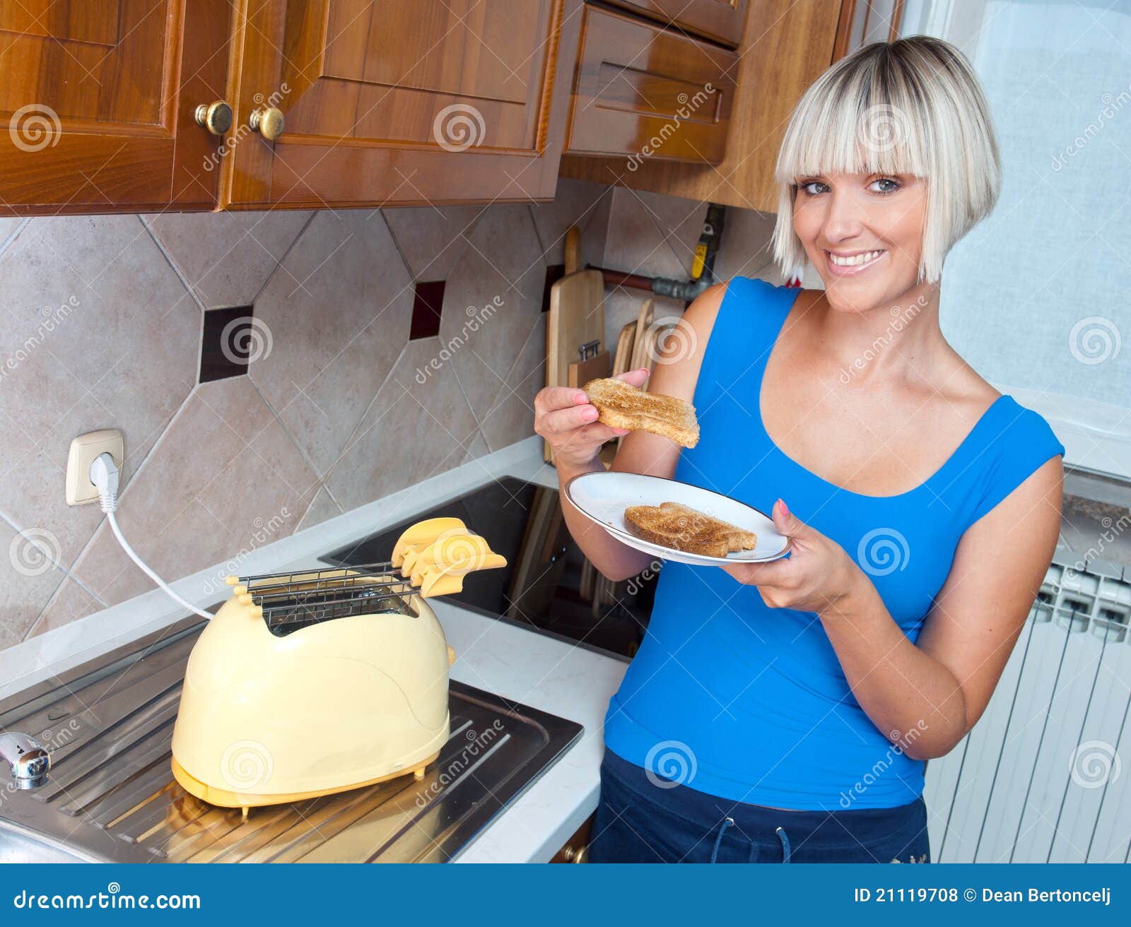 Attractive Woman Eating Toast Stock Photo - Image of morning, electric ...