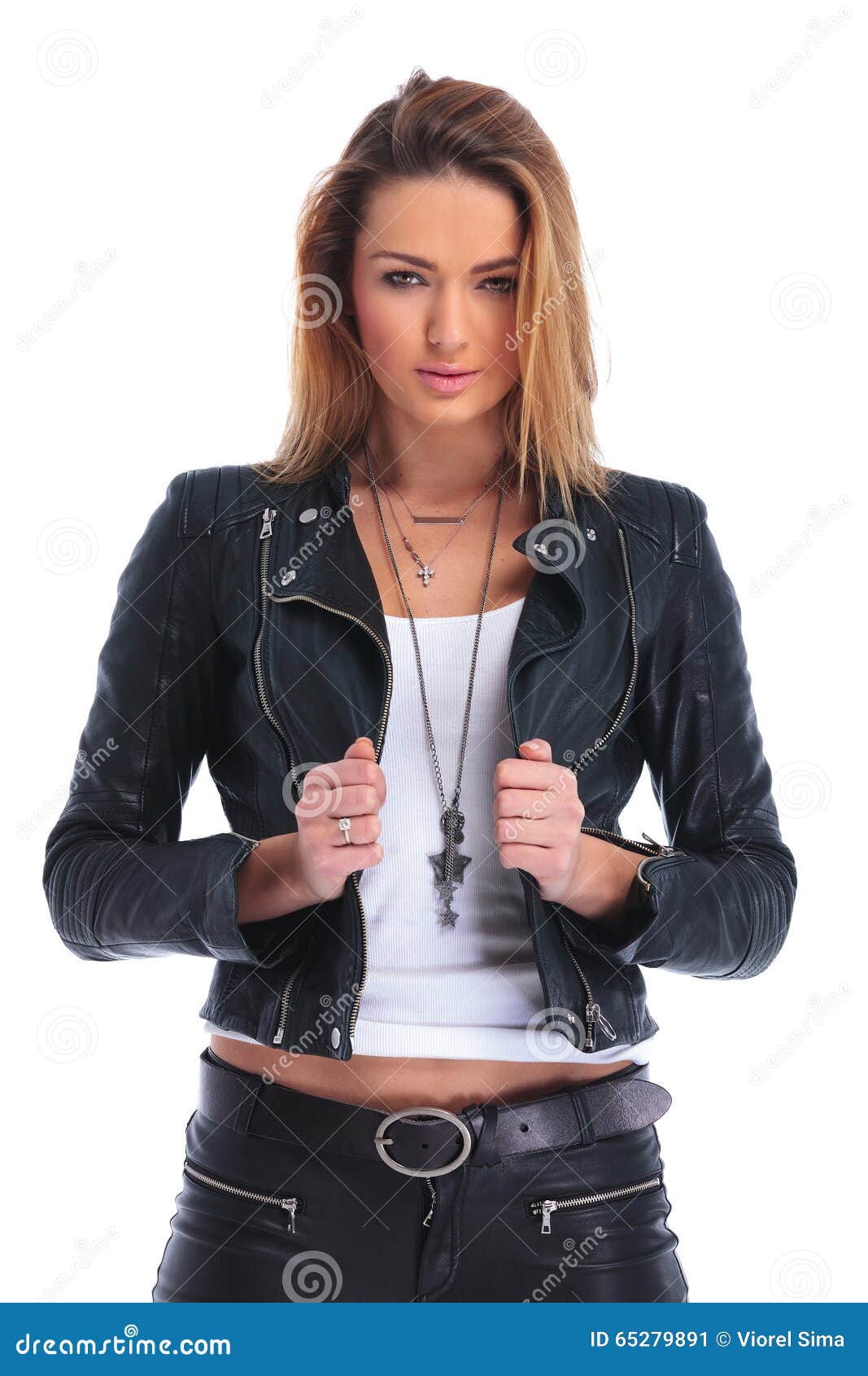 Attractive Woman Fixing Her Leather Jacket while Posing in Studio ...