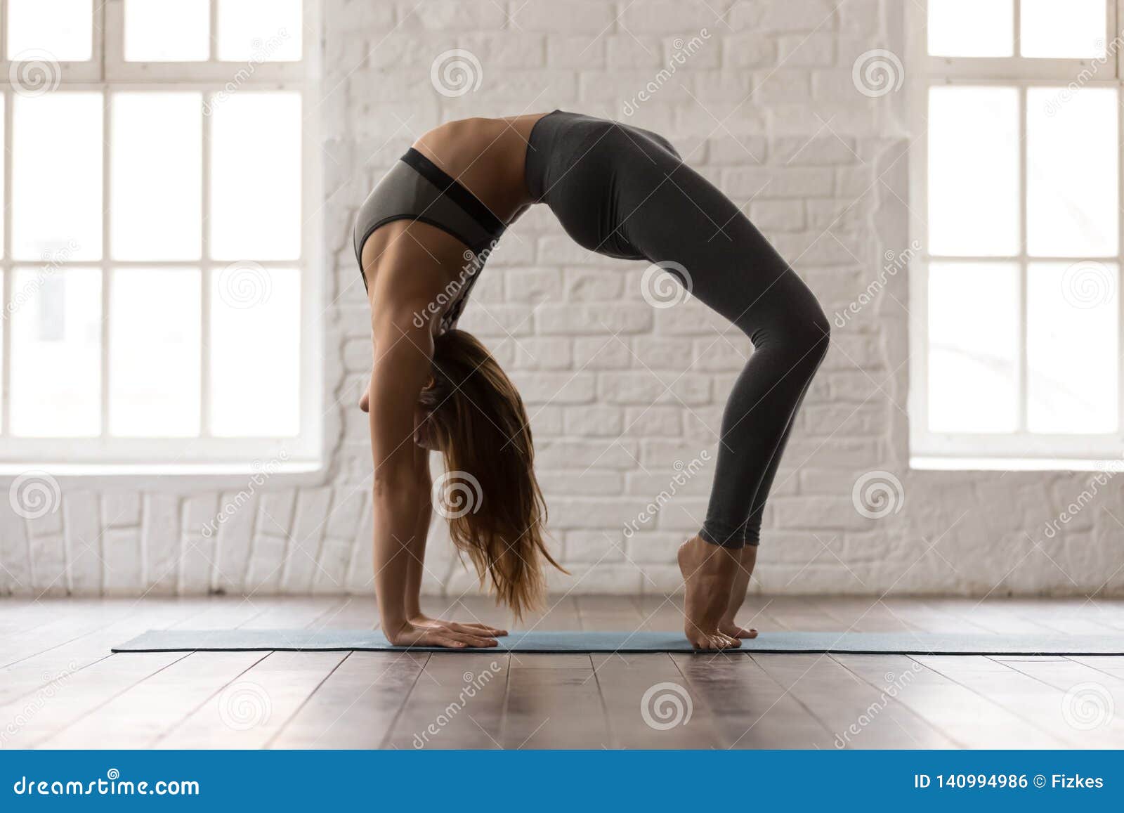 Attractive Woman Practicing Yoga Urdhva Dhanurasana Pose Bridge