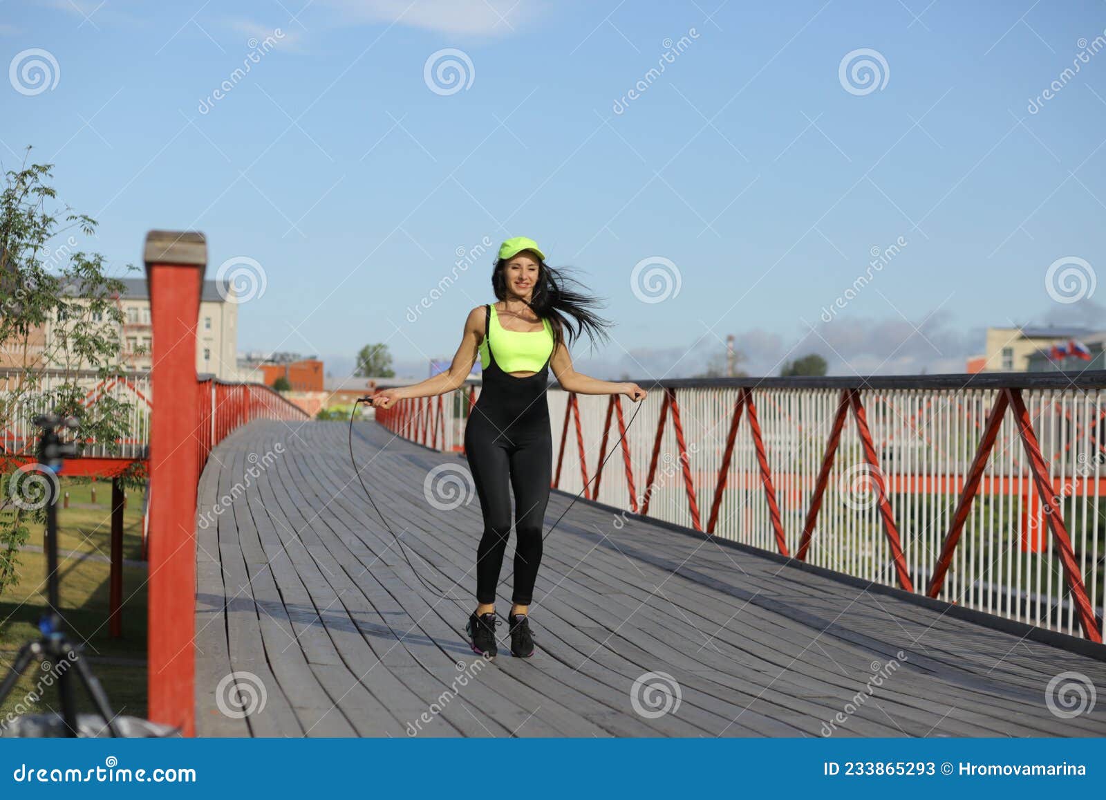 An Attractive Woman Jumping Rope on Bridge Stock Image - Image of ...