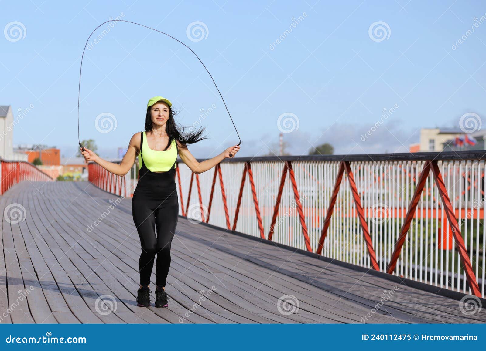 An Attractive Woman Jumping Rope on Bridge Stock Image - Image of cool ...
