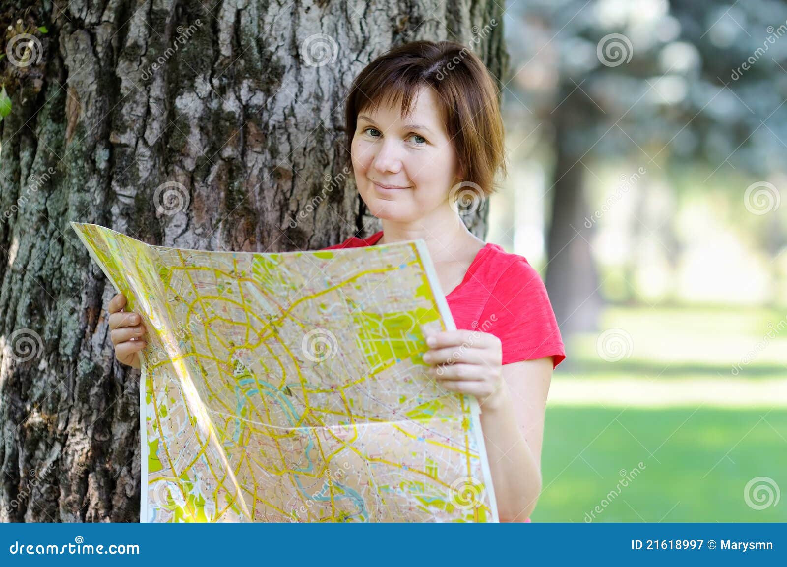 Attractive woman with map stock image. Image of concentration - 21618997