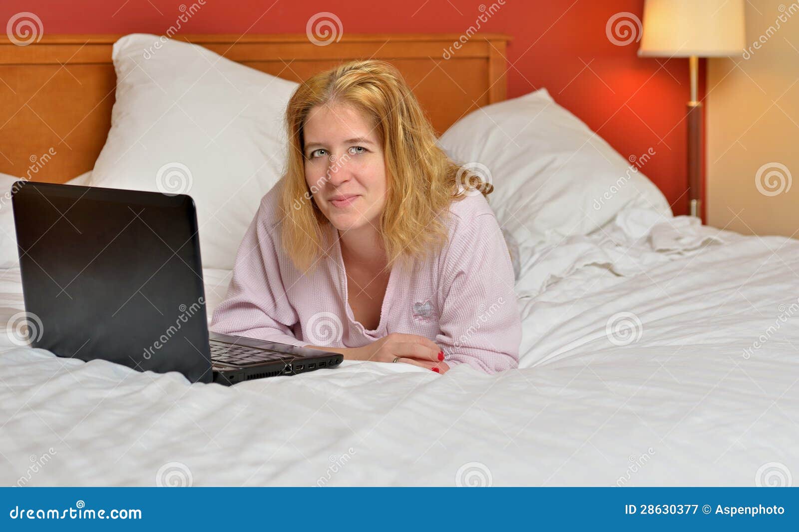 Attractive Woman in Pajamas in Bed with Laptop Computer Stock Image ...