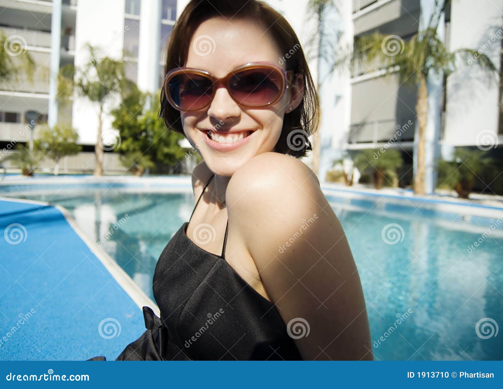 Attractive woman by pool stock photo. Image of teeth, beautiful - 1913710