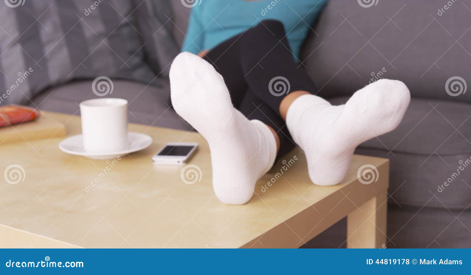 Attractive Woman Resting Her Feet on Table Stock Photo - Image of hair ...